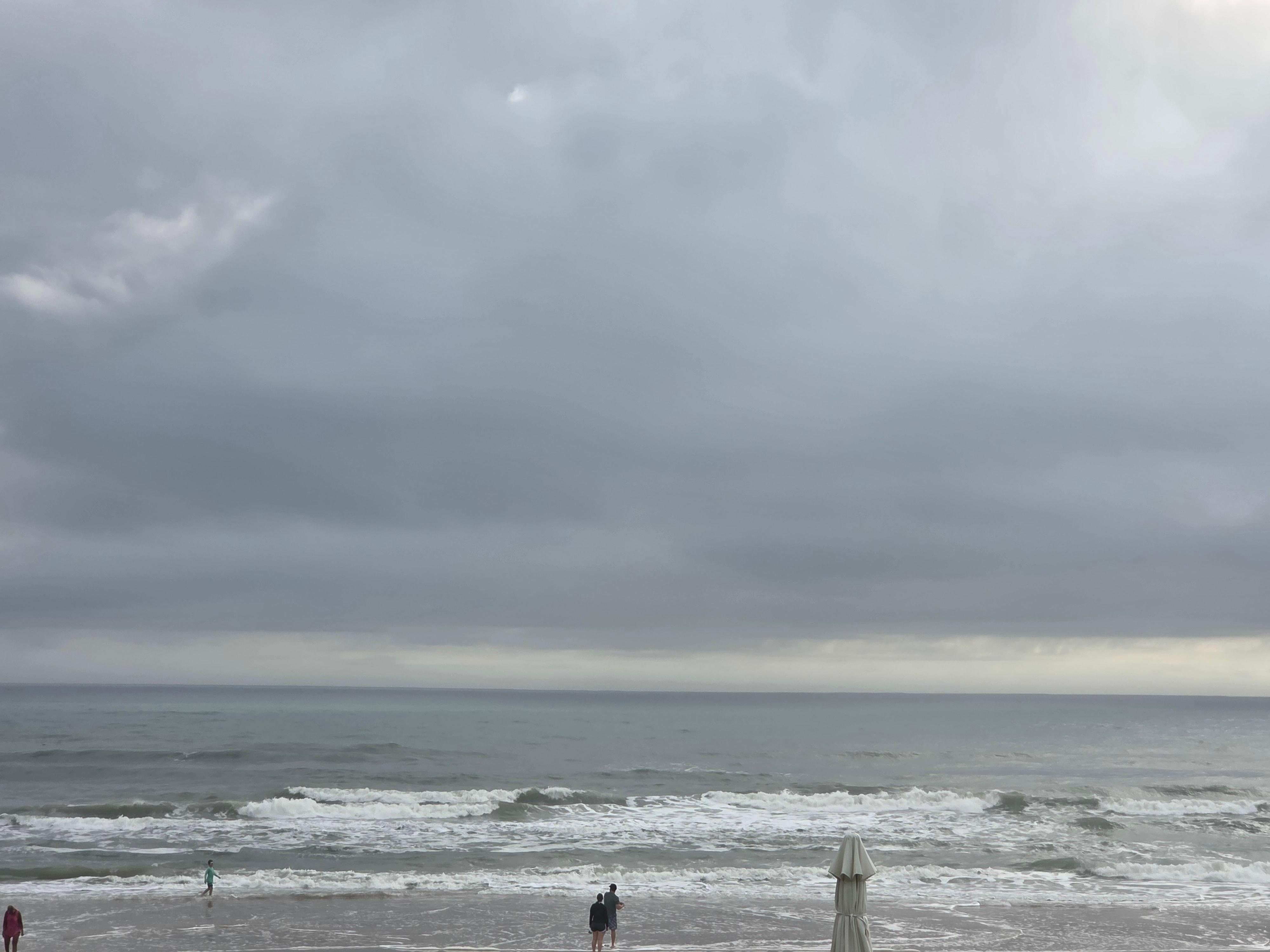 Picture of the beach from the back of my room on patio.