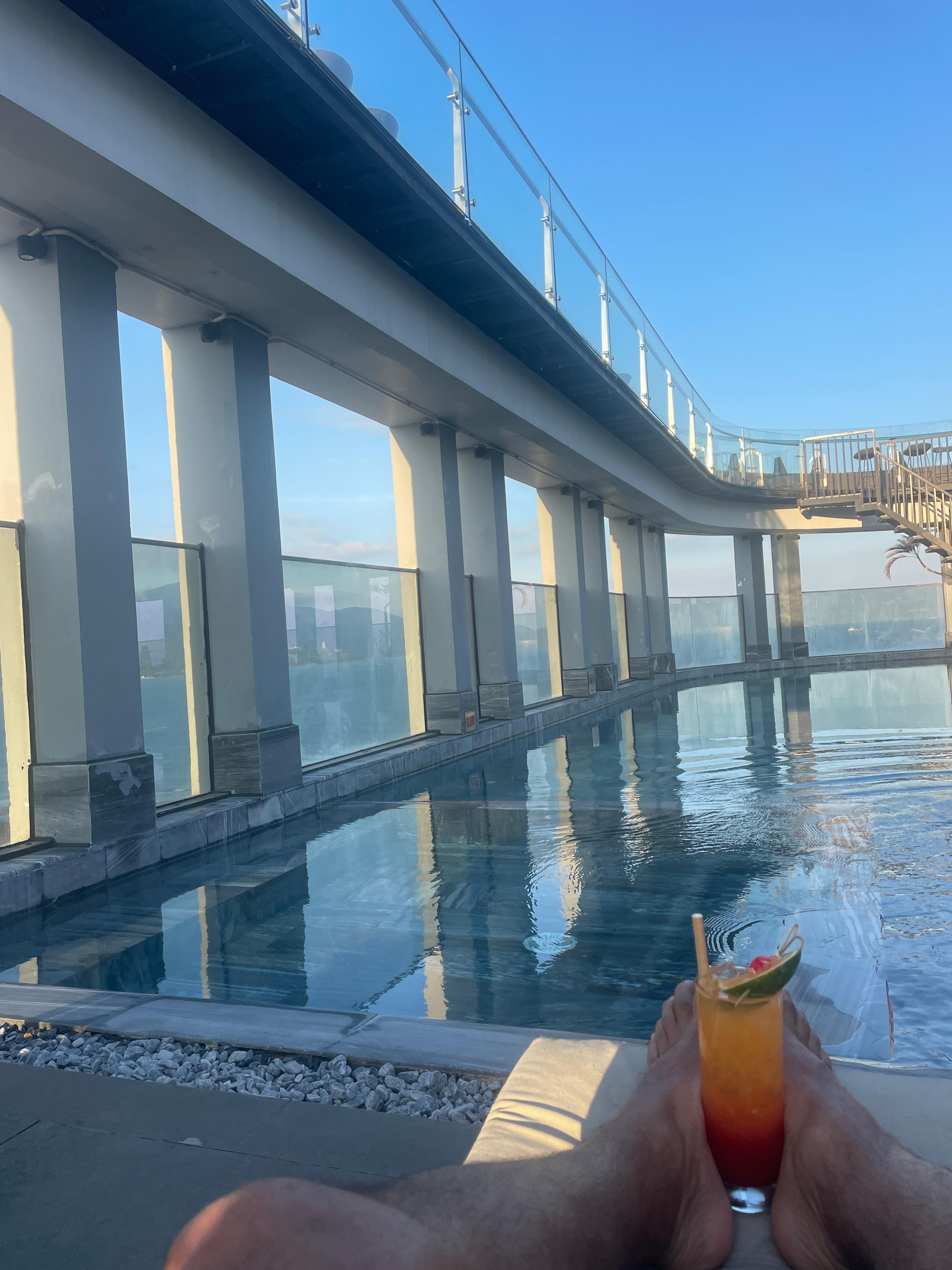Poolside 16th floor with first of two Tequila Sunrises. Do it.
