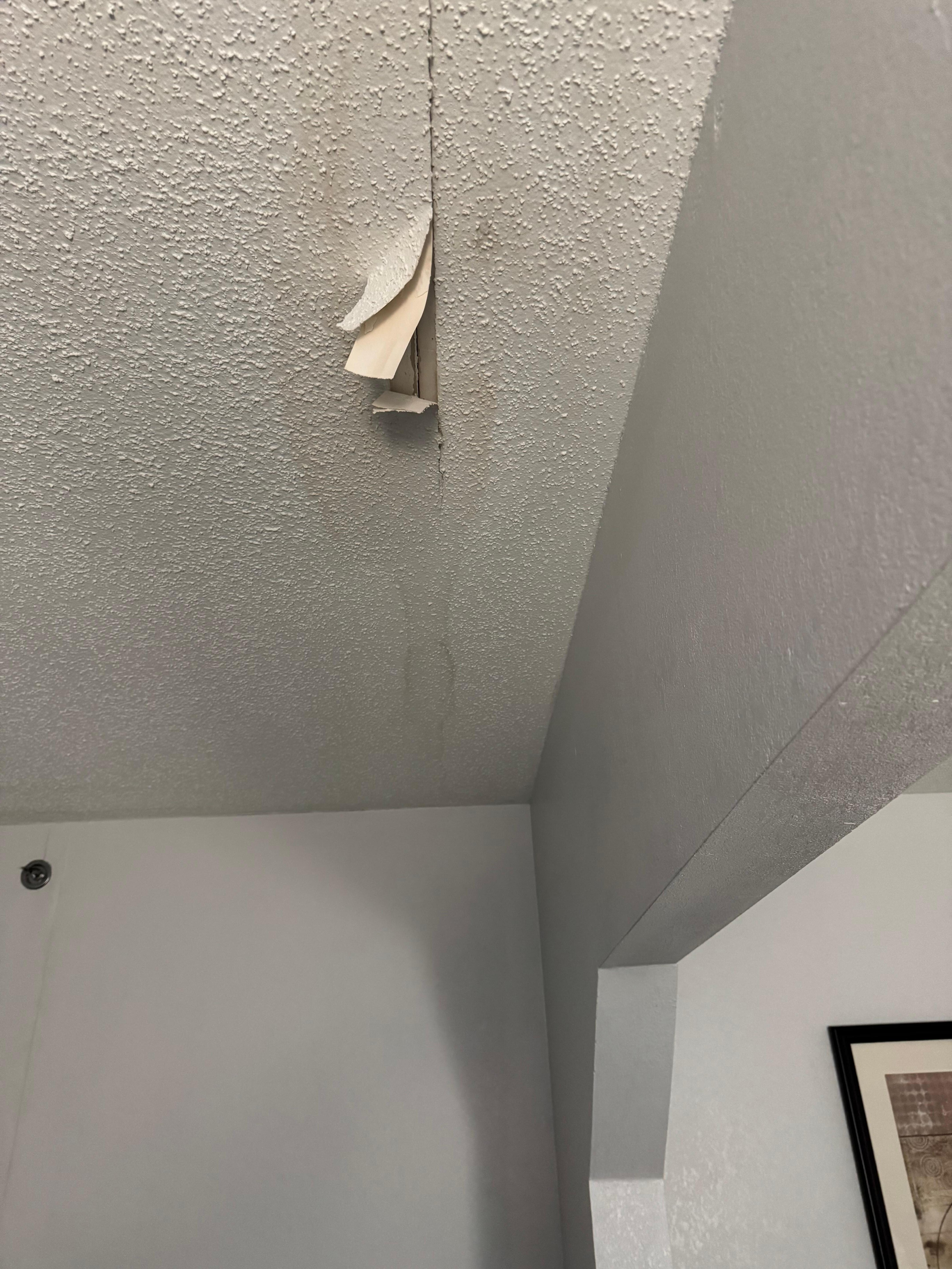 this is the plaster of the ceiling almost over the bed.  It’s coming out and water stained.  The room smelled bad, musty, mildew, moldy.