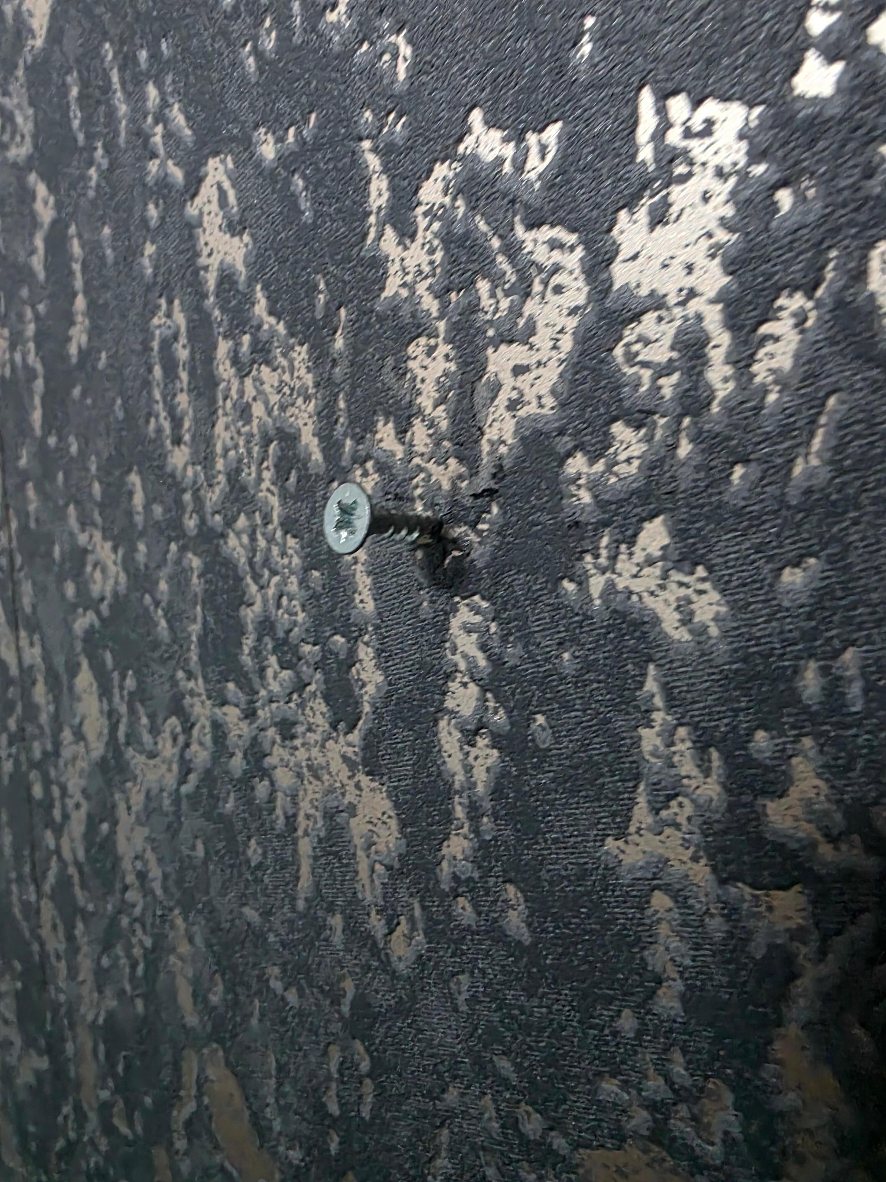 Screw blending with the wallpaper which would really hurt someone