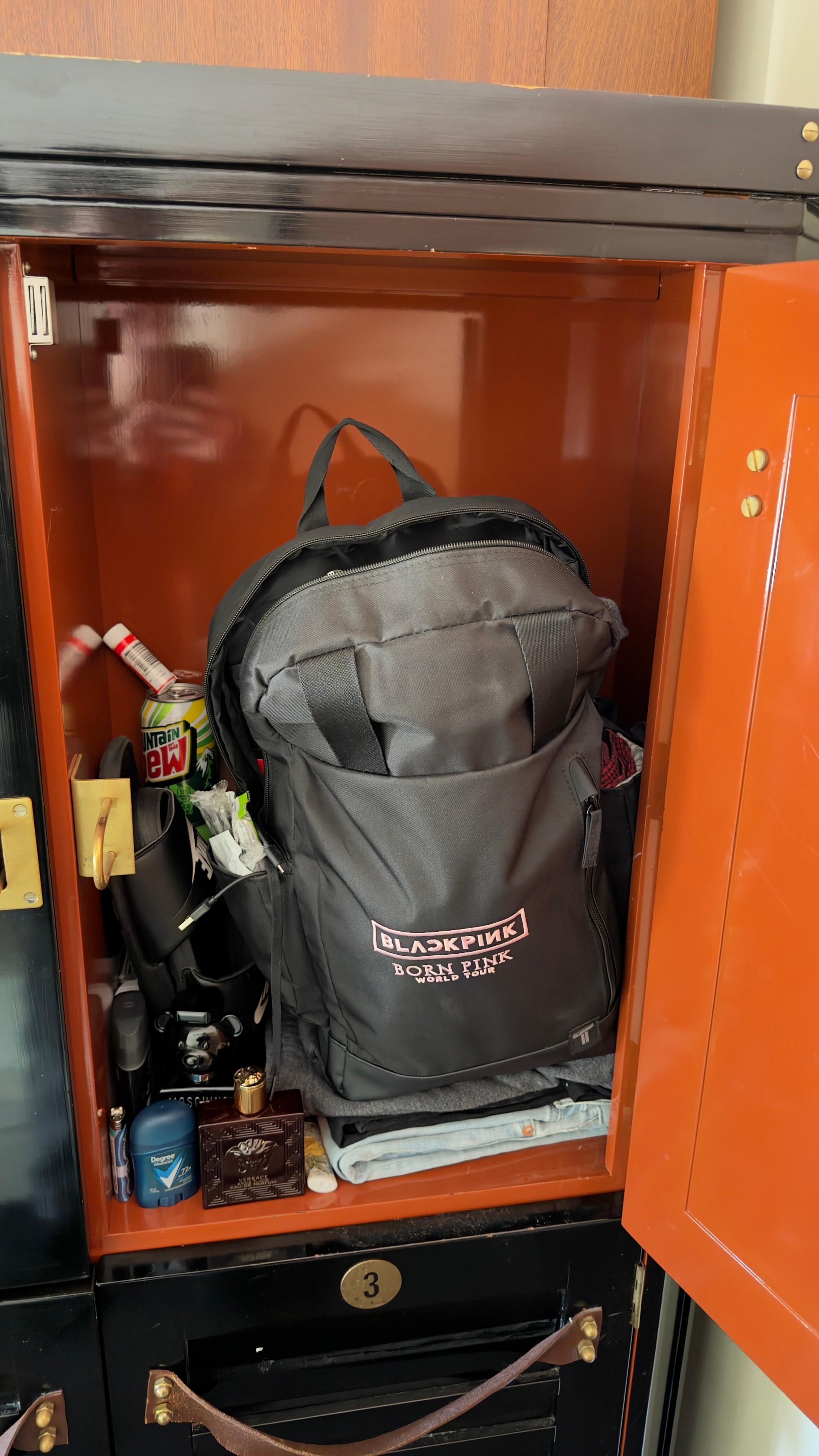 The locker with a large backpack inside