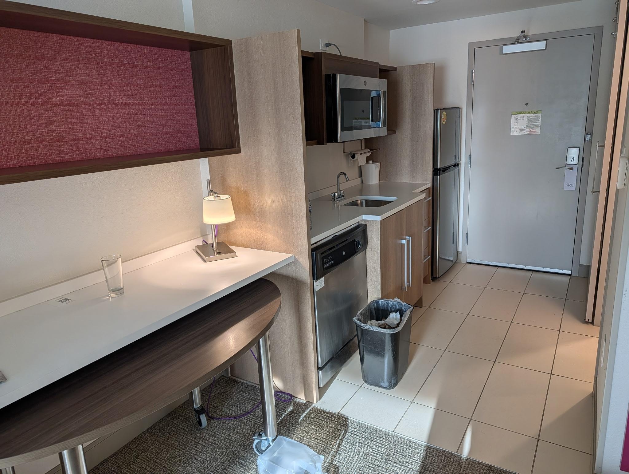 Kitchenette area in the room
In‑room kitchen setup with microwave and fridge
Kitchen space available in the suite