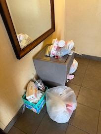Trash can in front of elevator