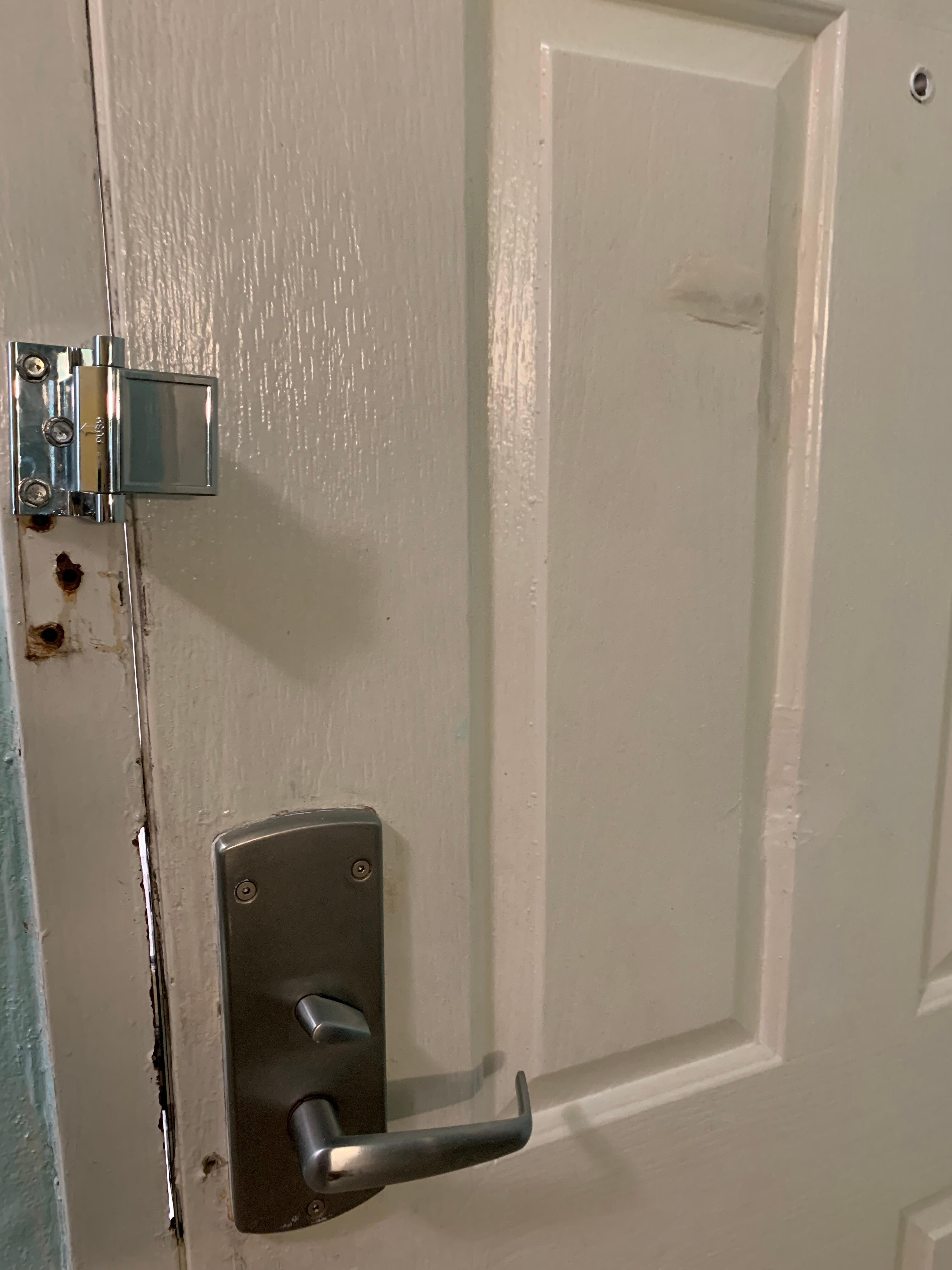 Fist dents, door jamb crack, safety latch after the friendly maintenance man fixed it. 