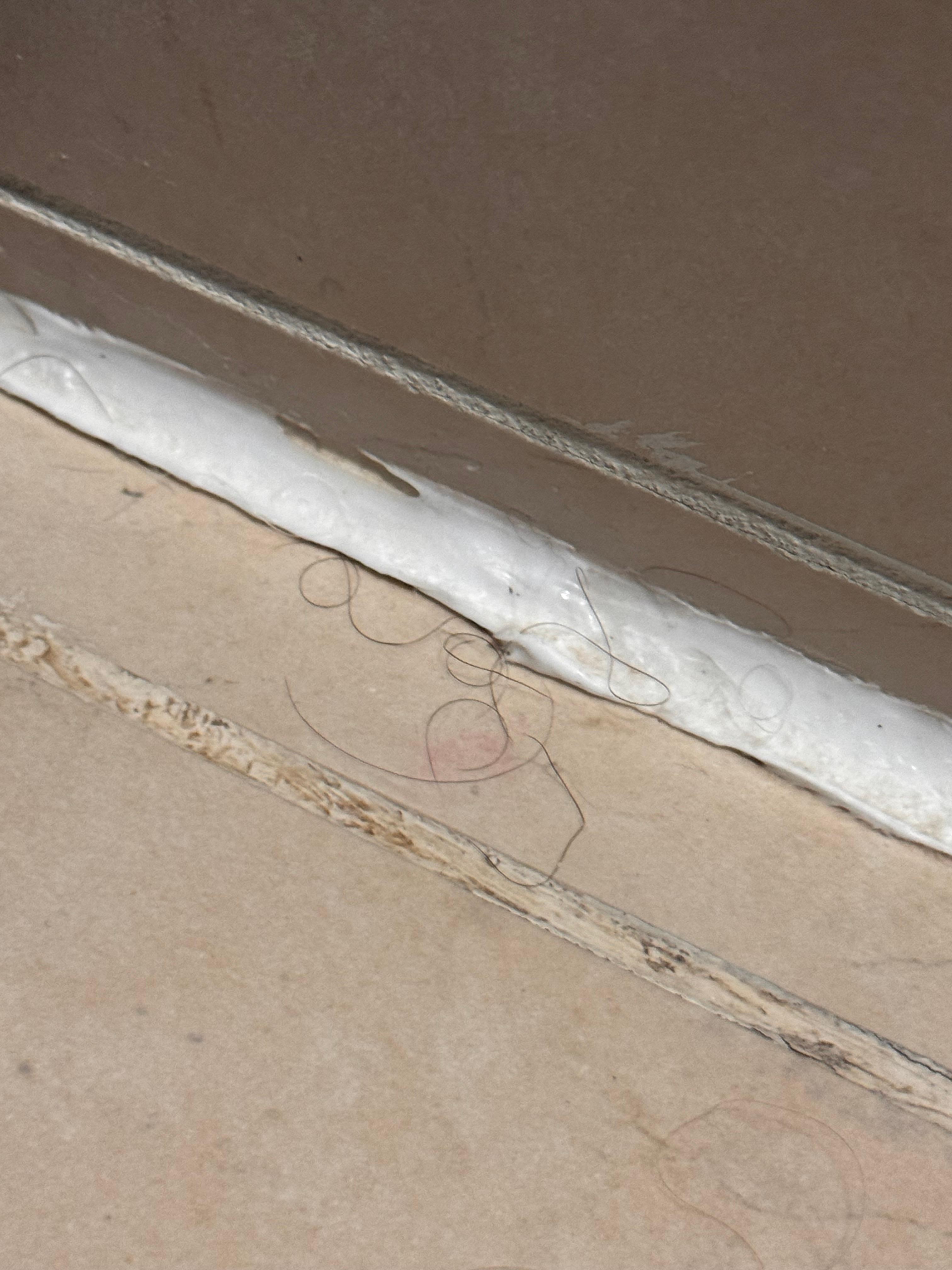 Black curly hair outside shower (my hair is blonde)