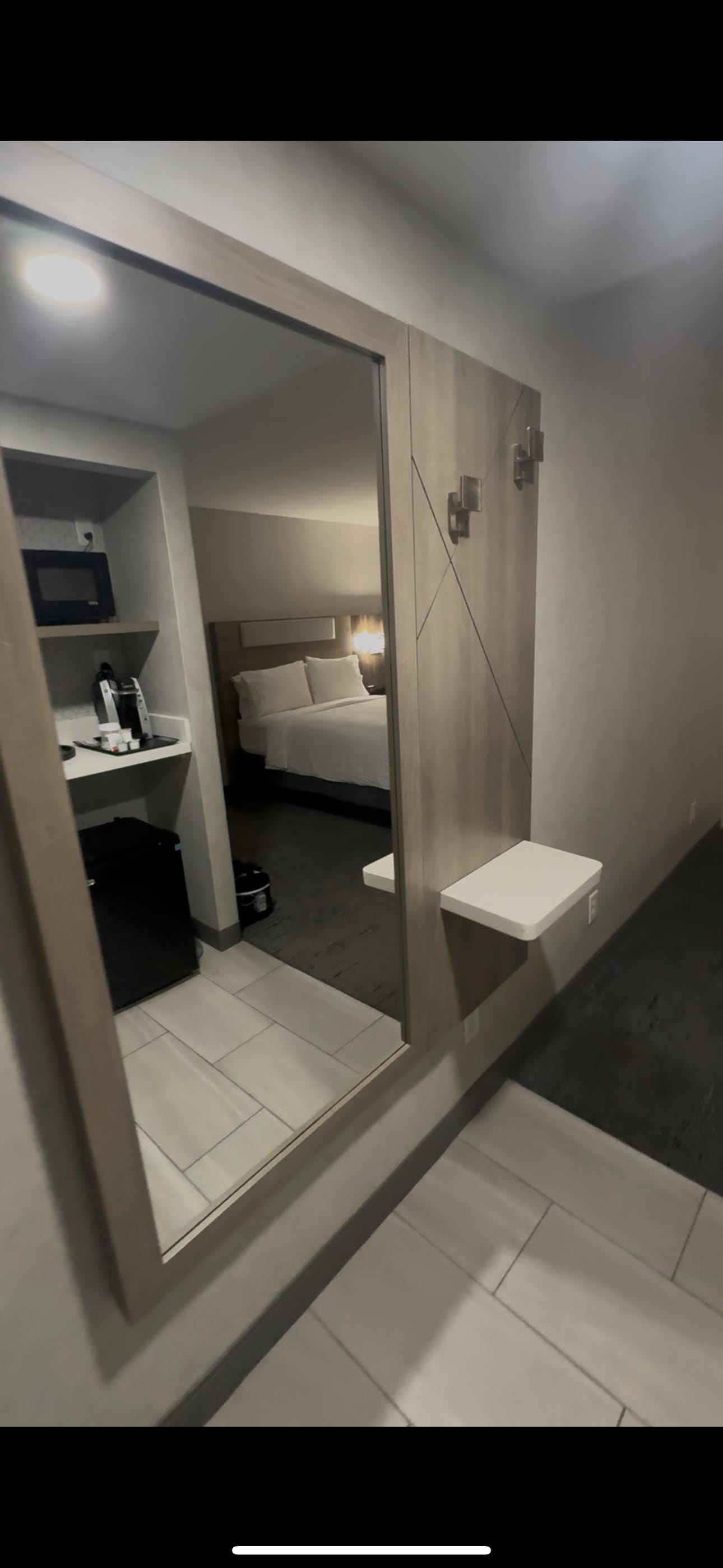 Huge mirror. Photo not shown but across from it was coffee maker, fridge, & microwave 