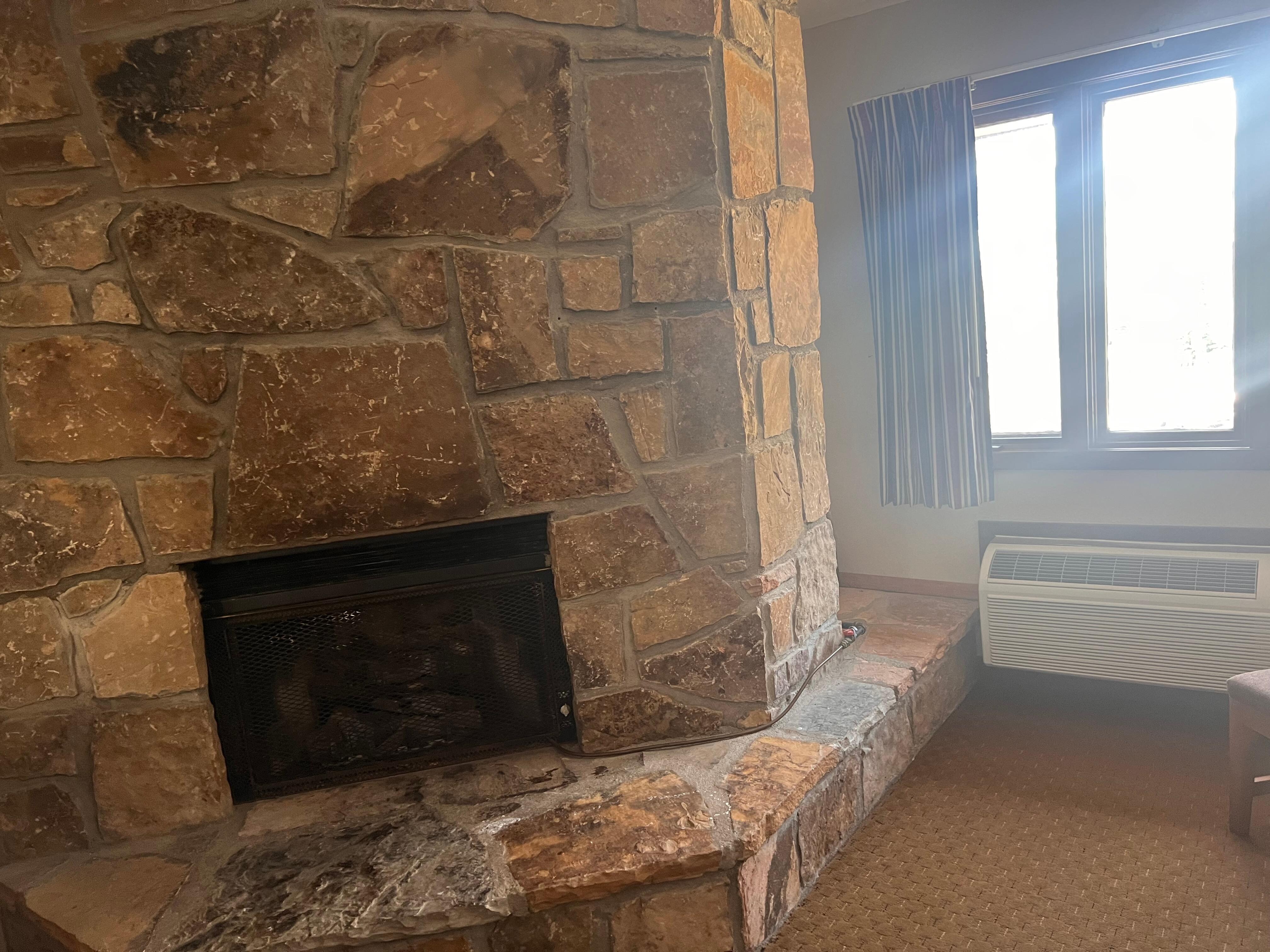 Fireplace infront of the bed 