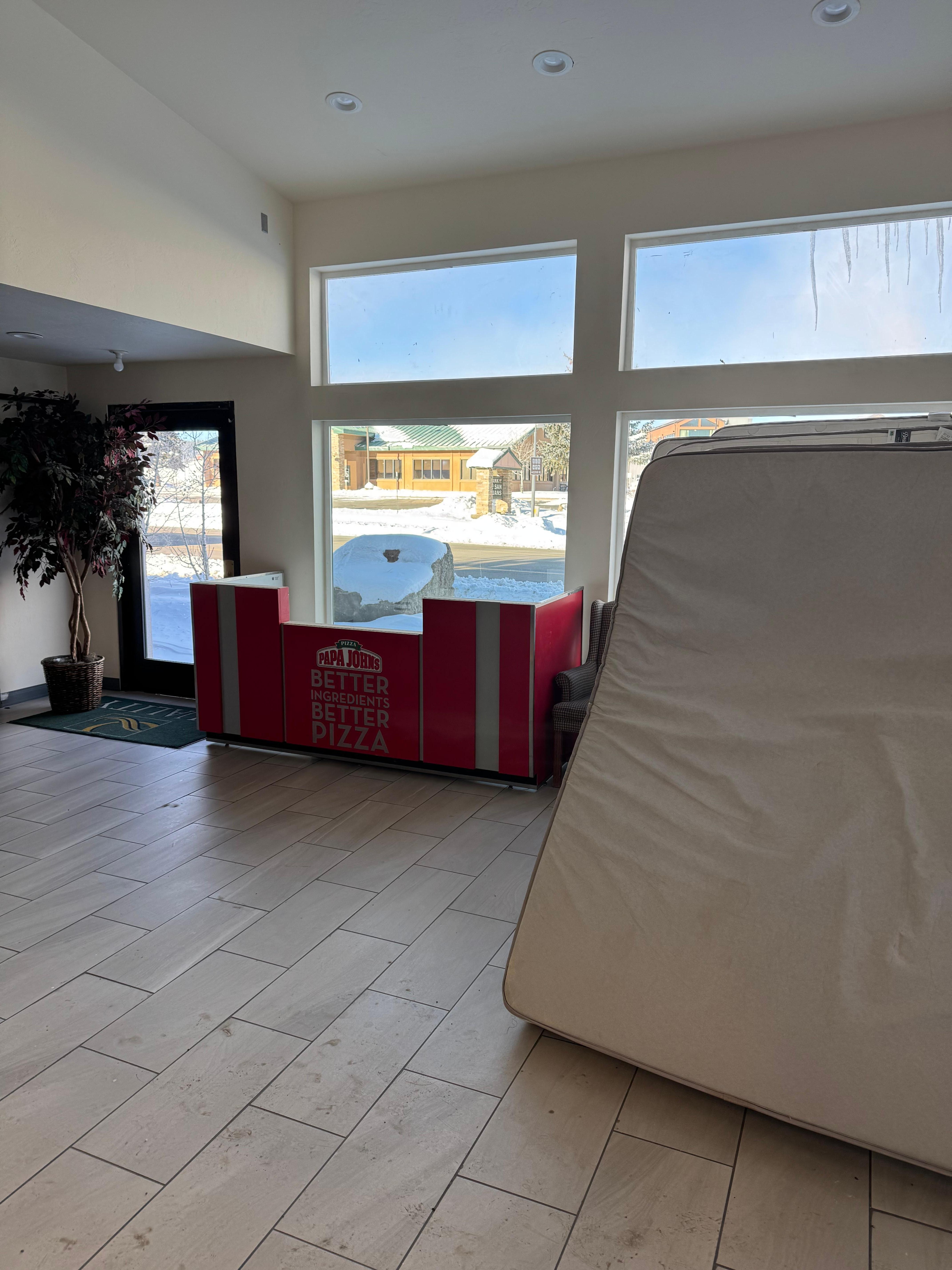 old dirty mattresses in the lobby. and papa john’s? weird. 