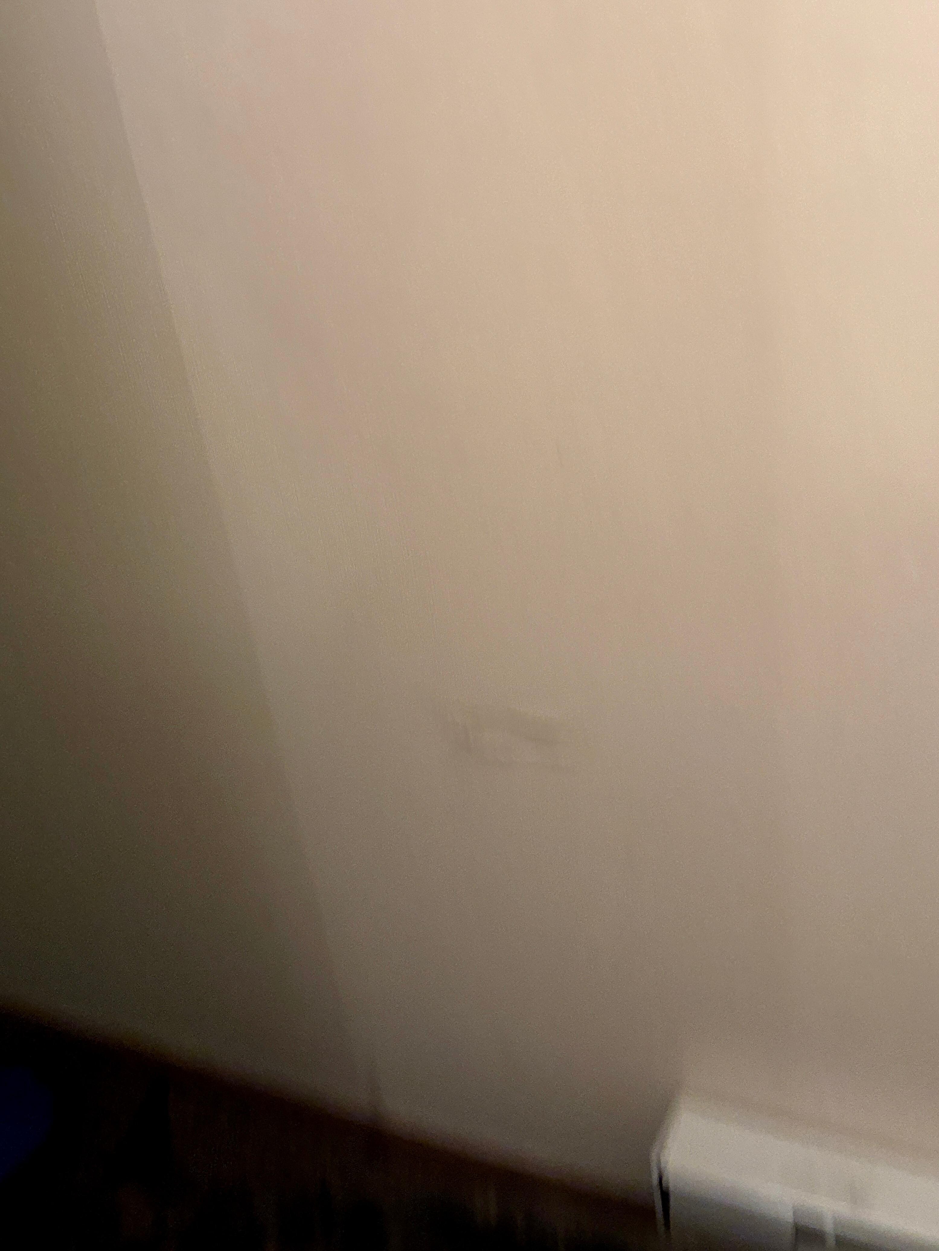 Scuffed walls with holes in them. 