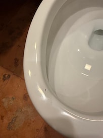 Dirty toilet in second room.