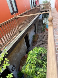View looking down on hotel from upper patio