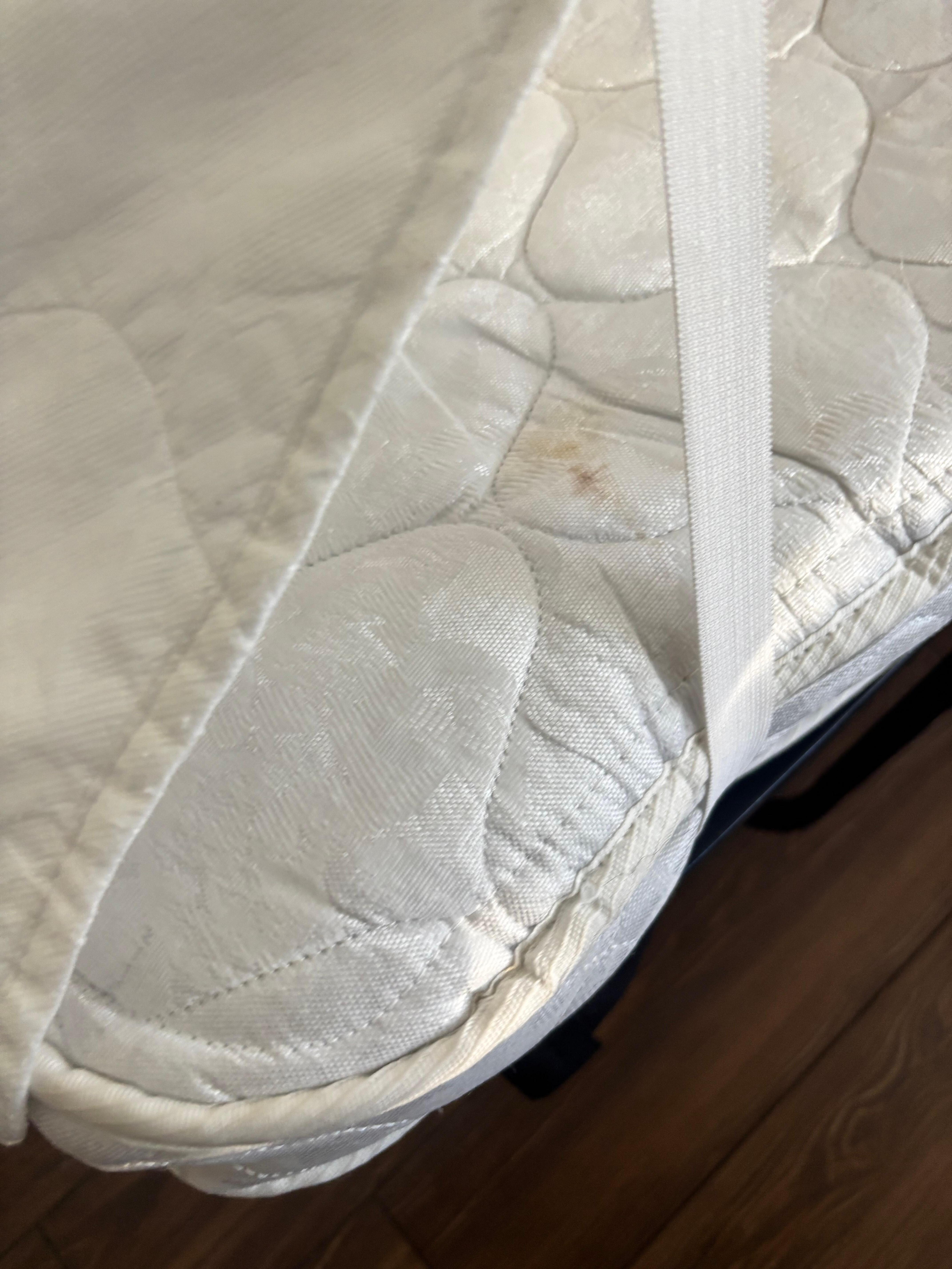 Stains covered the mattress.