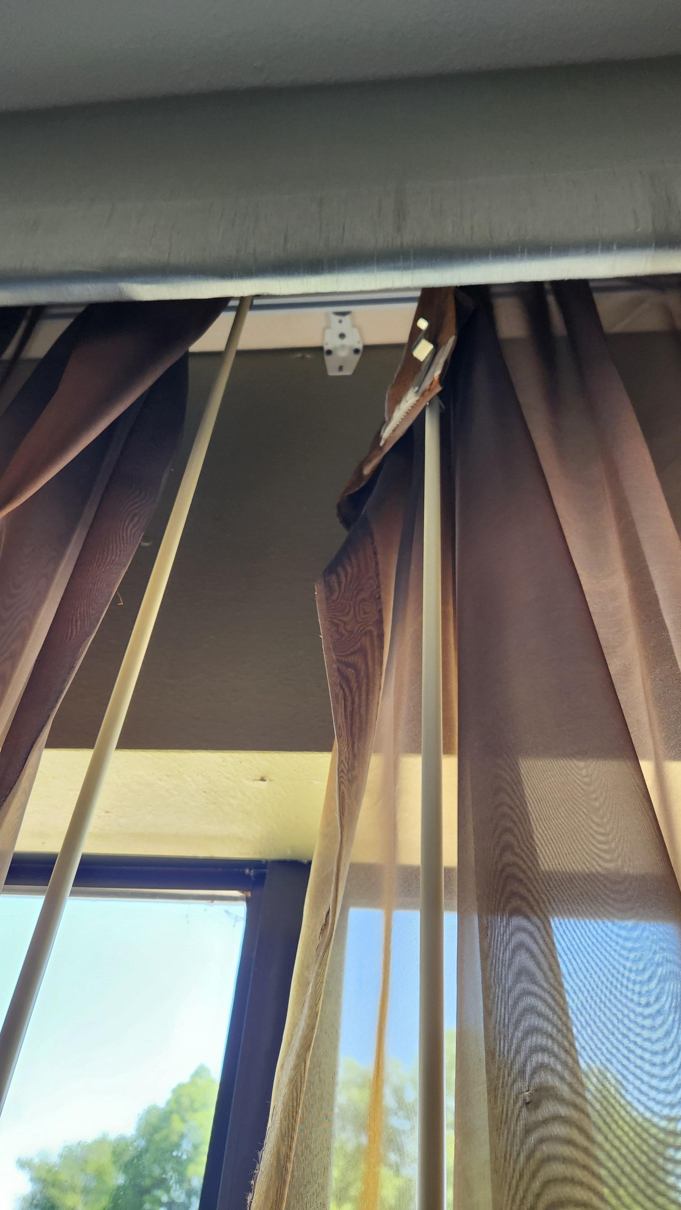 Curtains hanging off track 