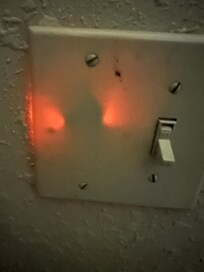 Not sure what this red light is for at the door light switch but it is certainly there.