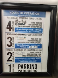 Operating hours posted inside elevator