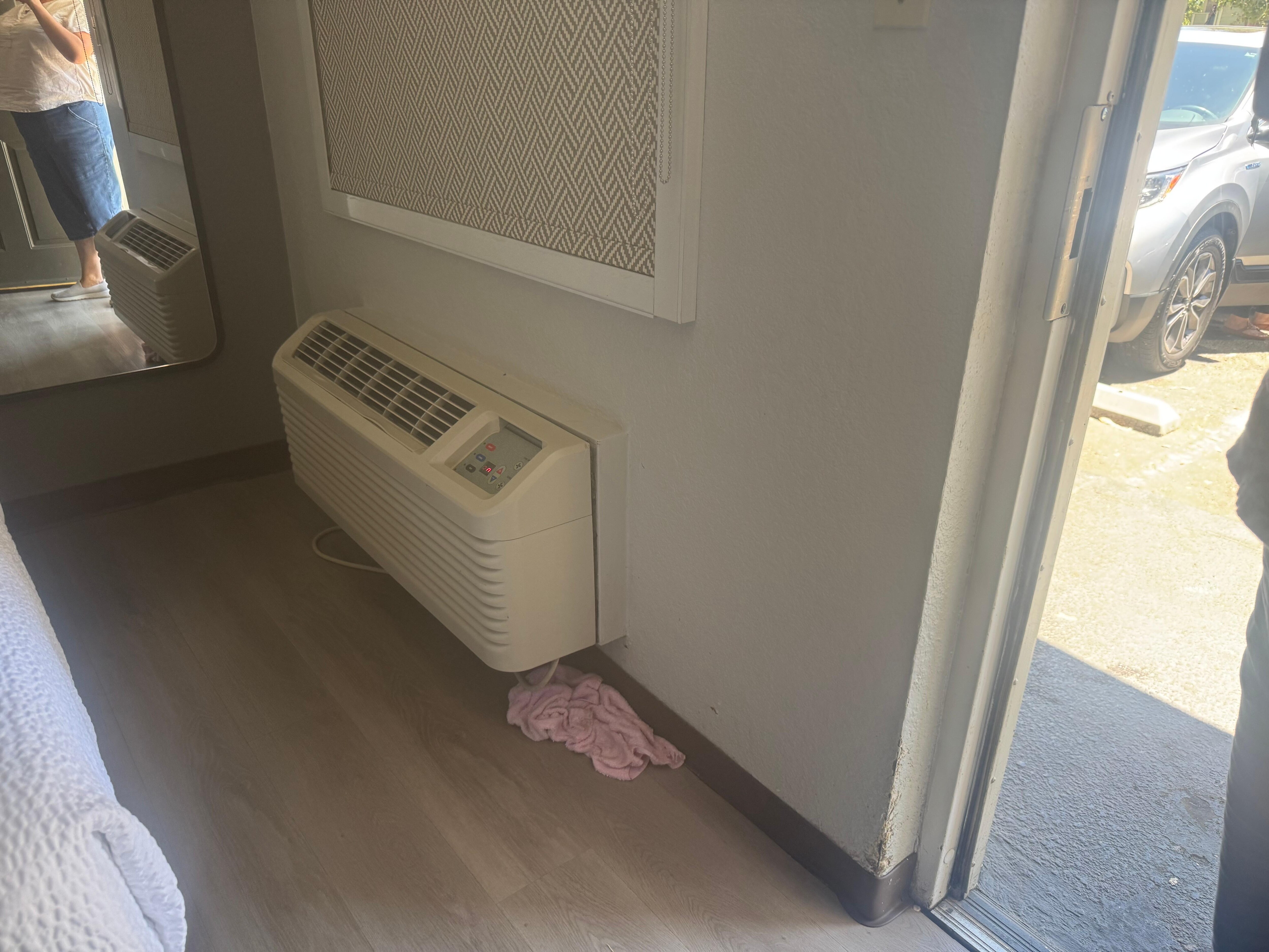 Wet dirty towel on the floor. 