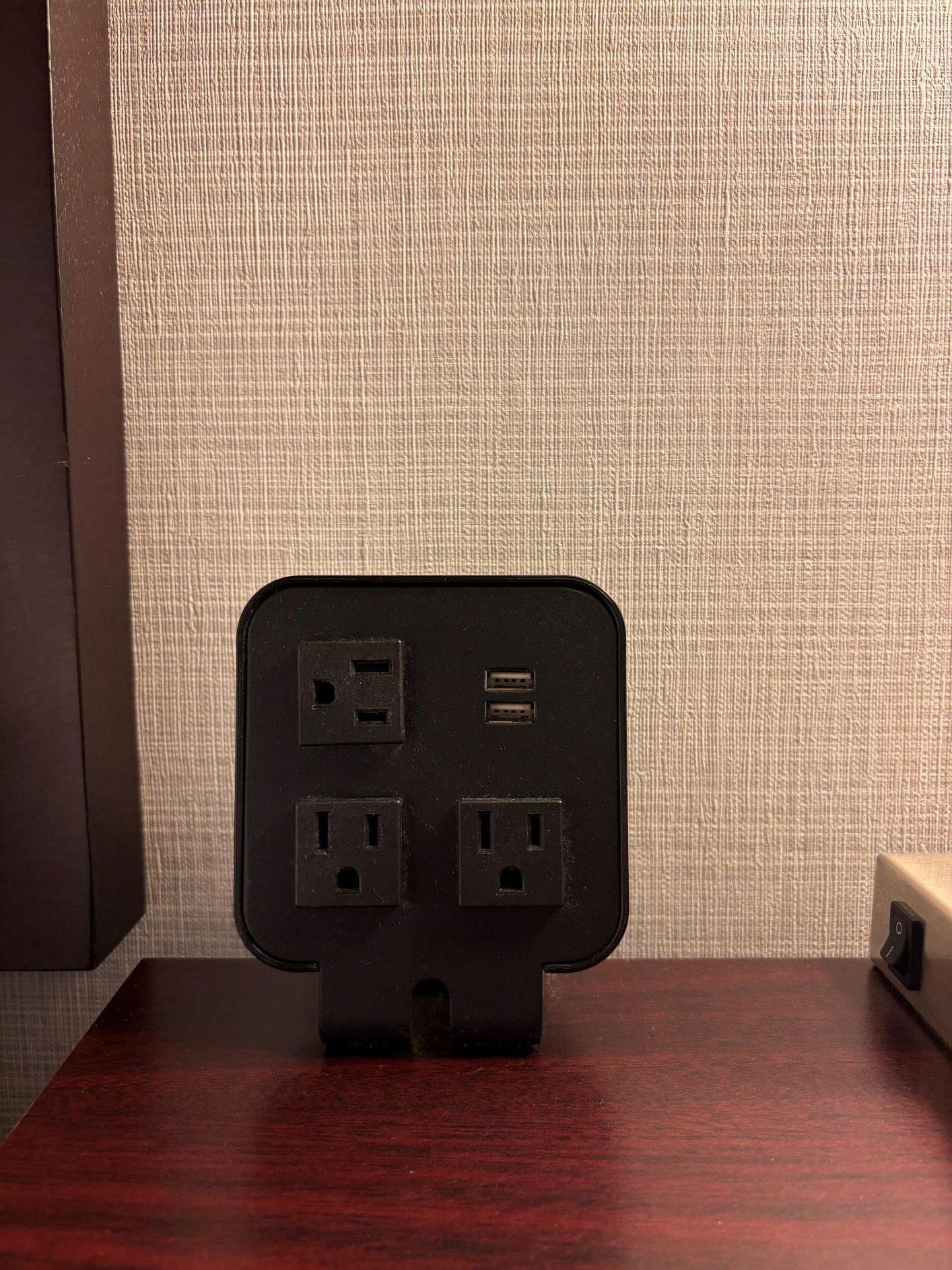 I found a couple of these in the room. This one is located between the beds. A couple of USB-A plugs, but no C plugs