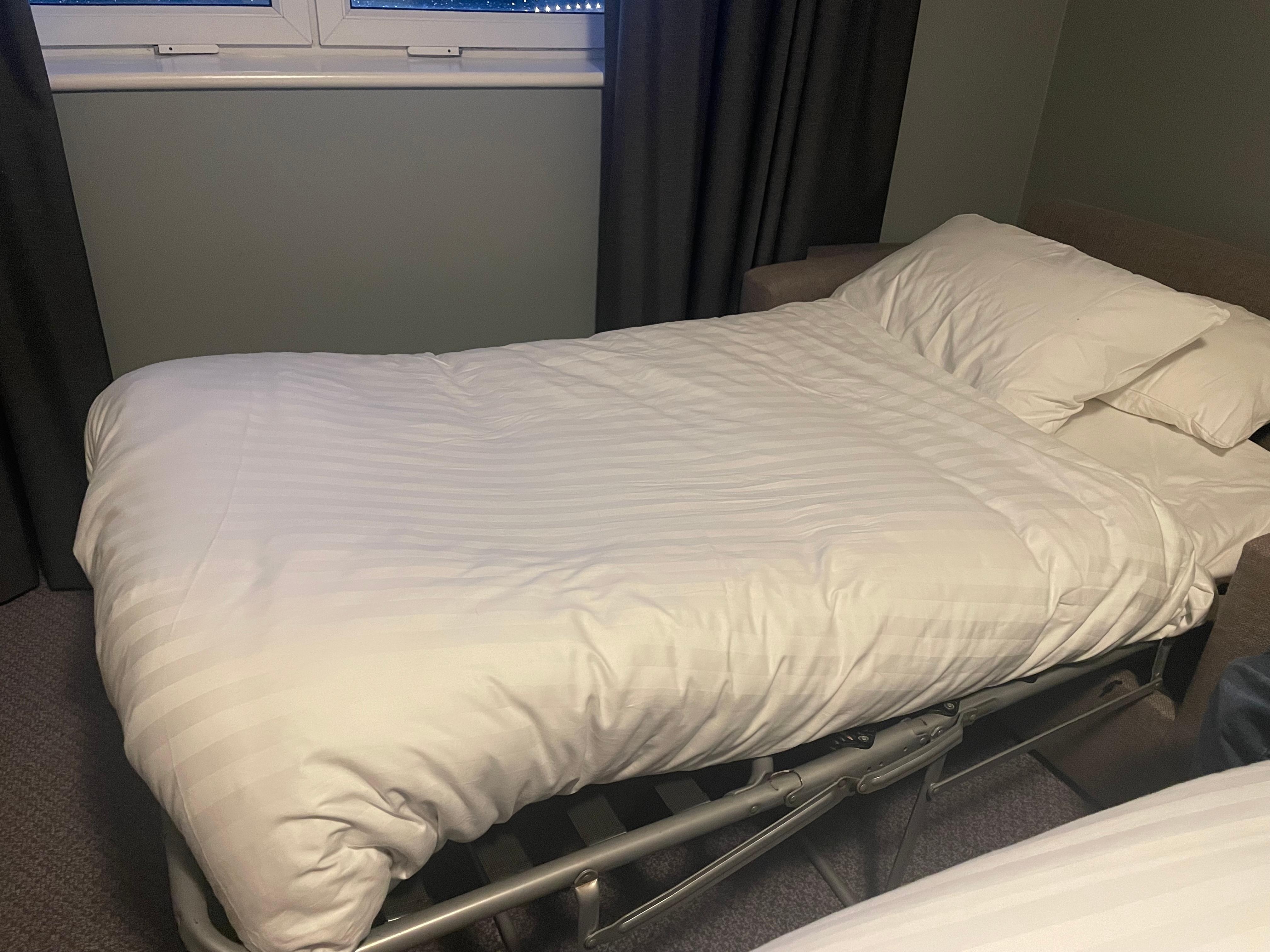 Unless you’re a toddler or smaller, you would not be able to sleep on this sofa bed.