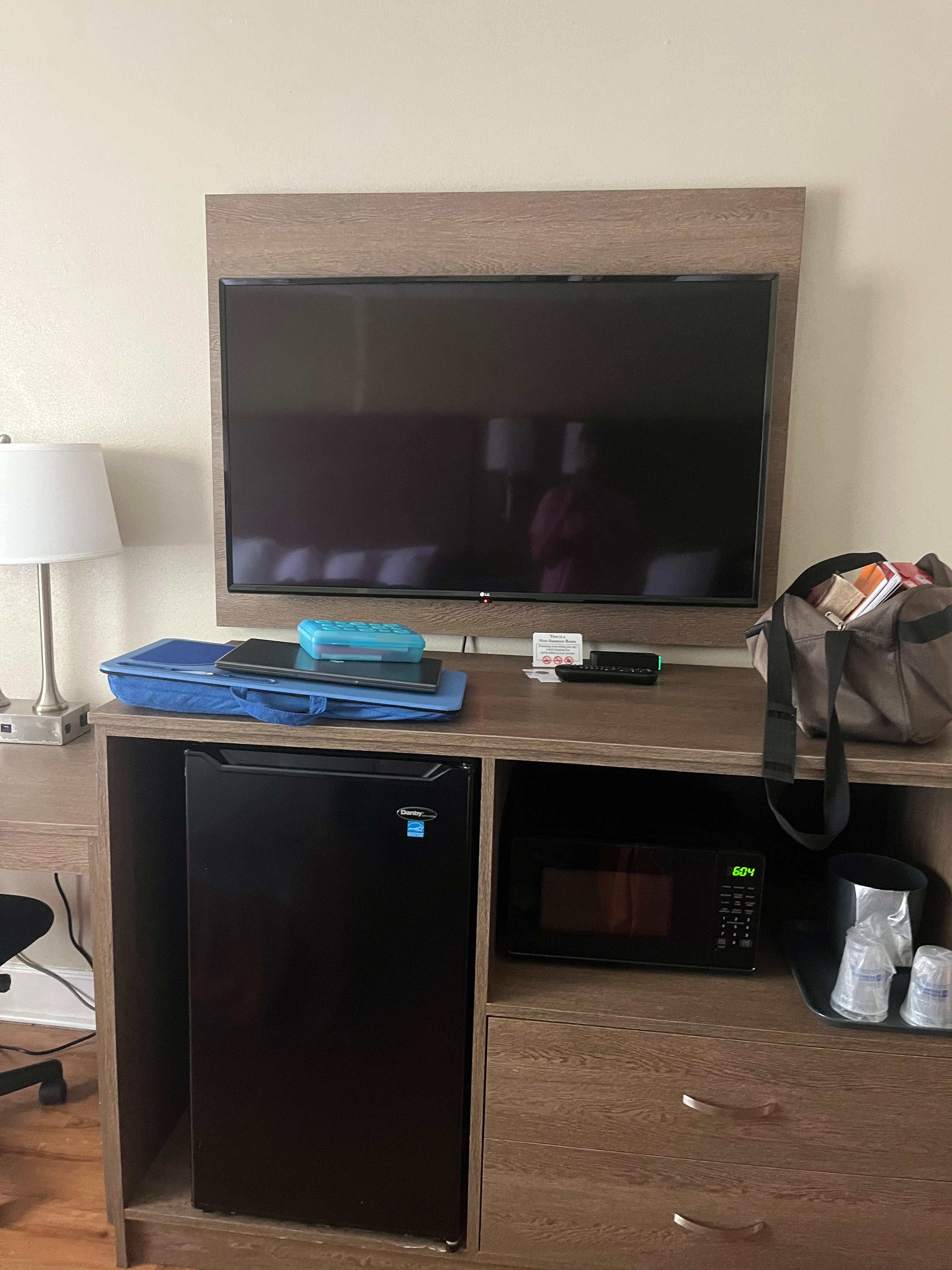 Tv area with microwave and mini fridge