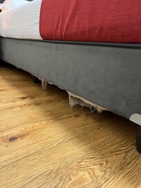Torn bed upholstery