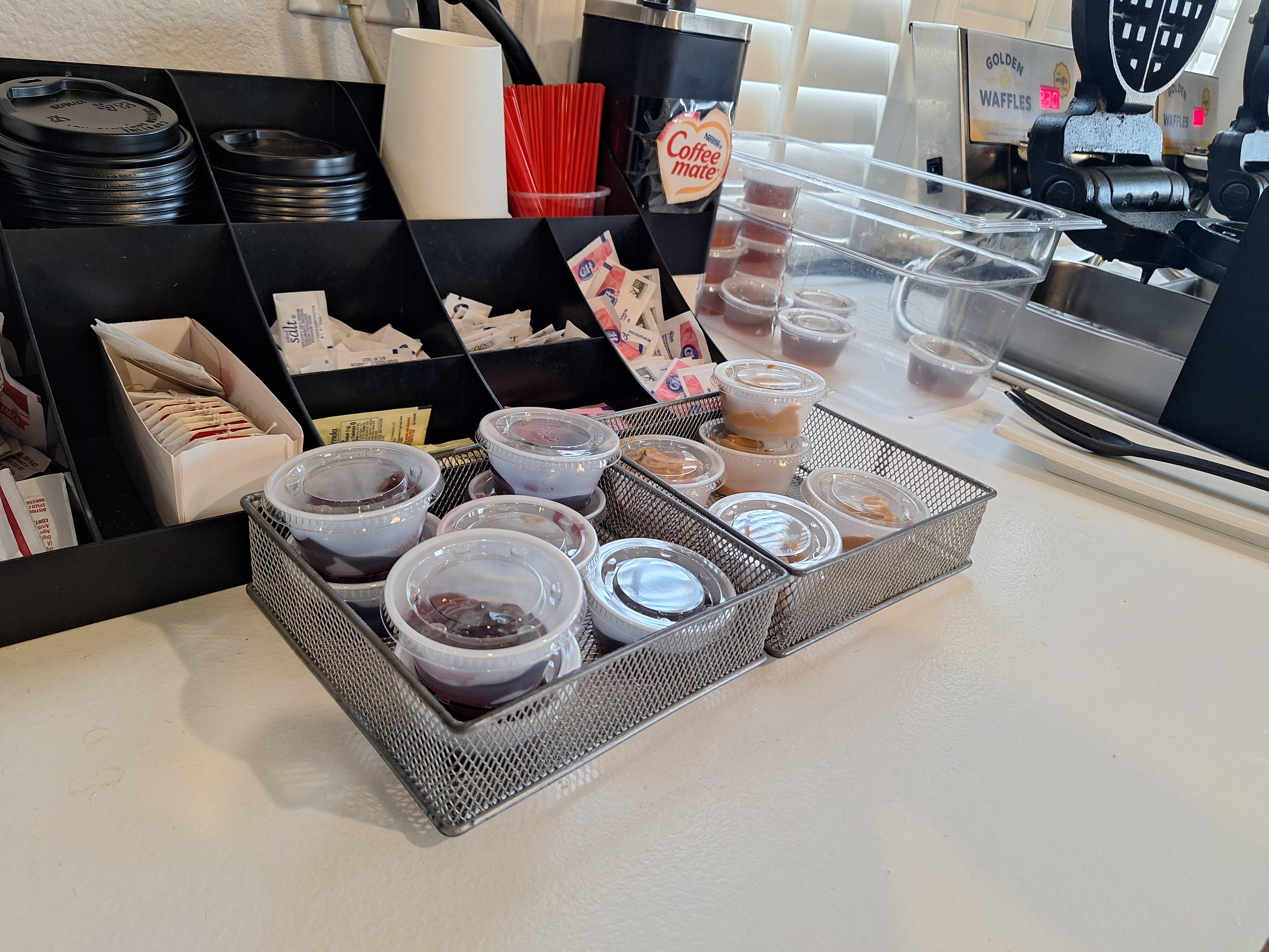 Jelly, butter, peanut butter, syrup, cream cheese etc all pre portioned in 2 oz cups with lids.  Kinda gross.