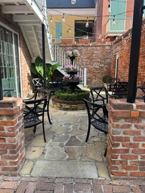 Another little courtyard with a fountain by room entrance