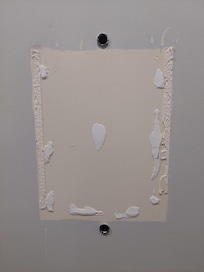 Something ripped off wall and not repainted.
