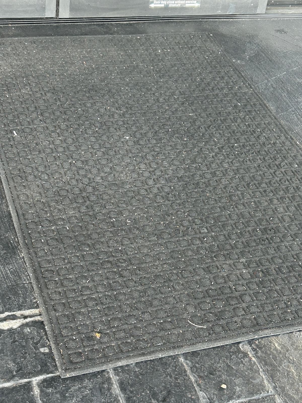 The entrance carpet was very dusty.