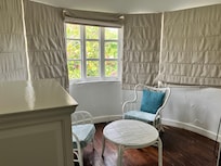 Sitting room in bedroom with a gorgeous tree that we call an orchid tree. There’s also a closet and huge dresser in that area.