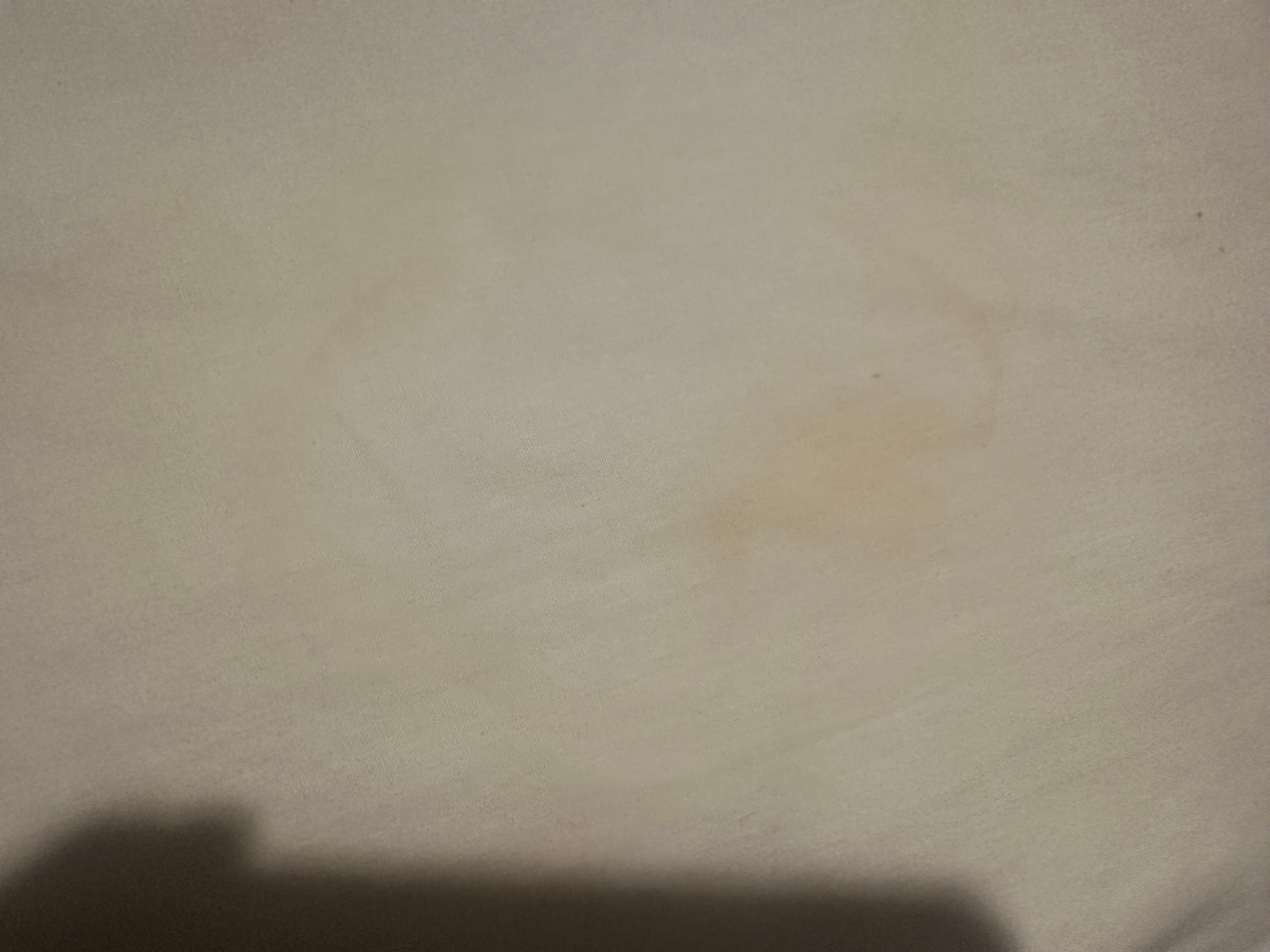 Brown stain on bed sheets