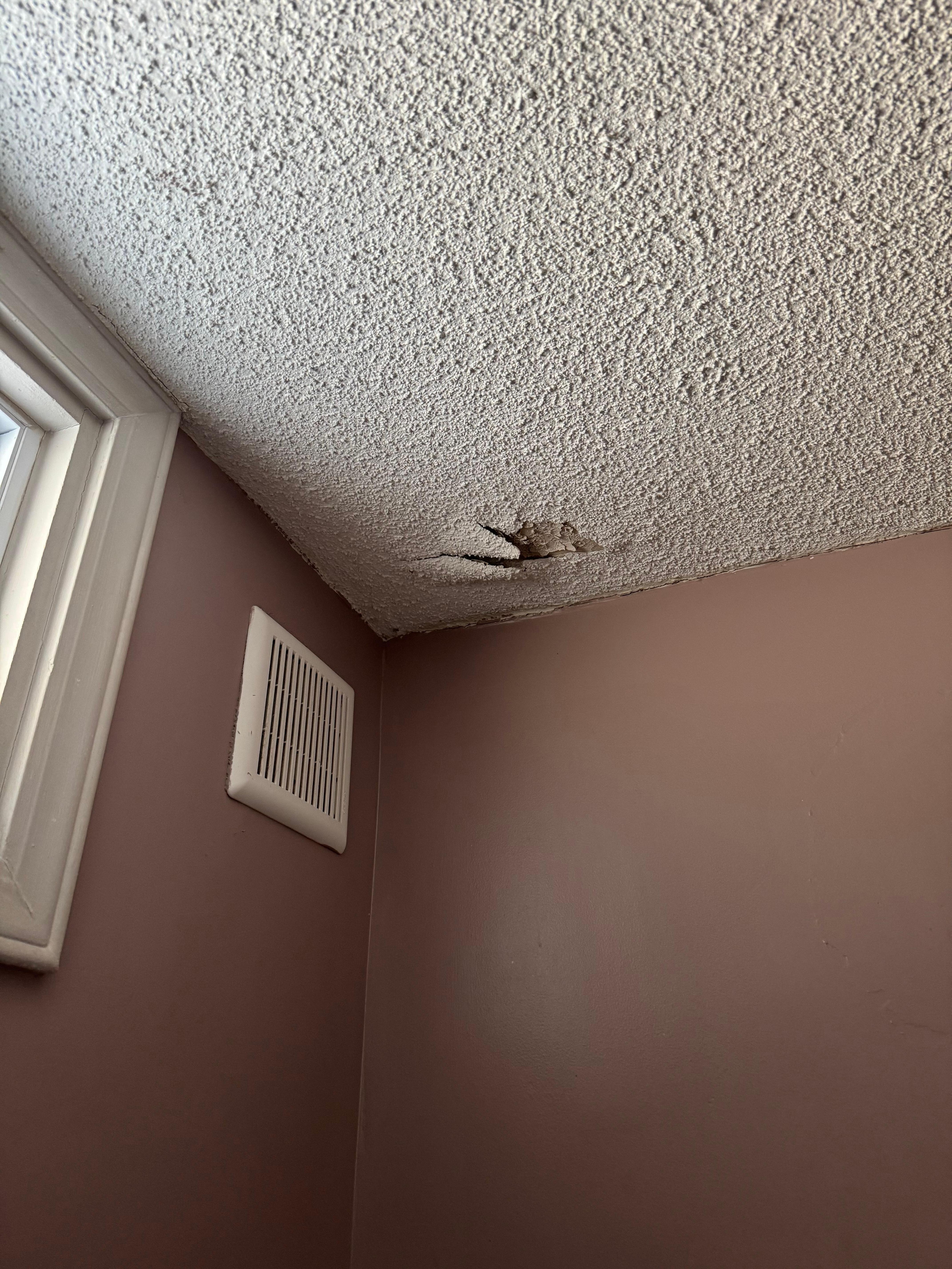 Mold  and hole in bathroom being 