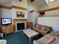 Sunken livingroom with gas fireplace.
