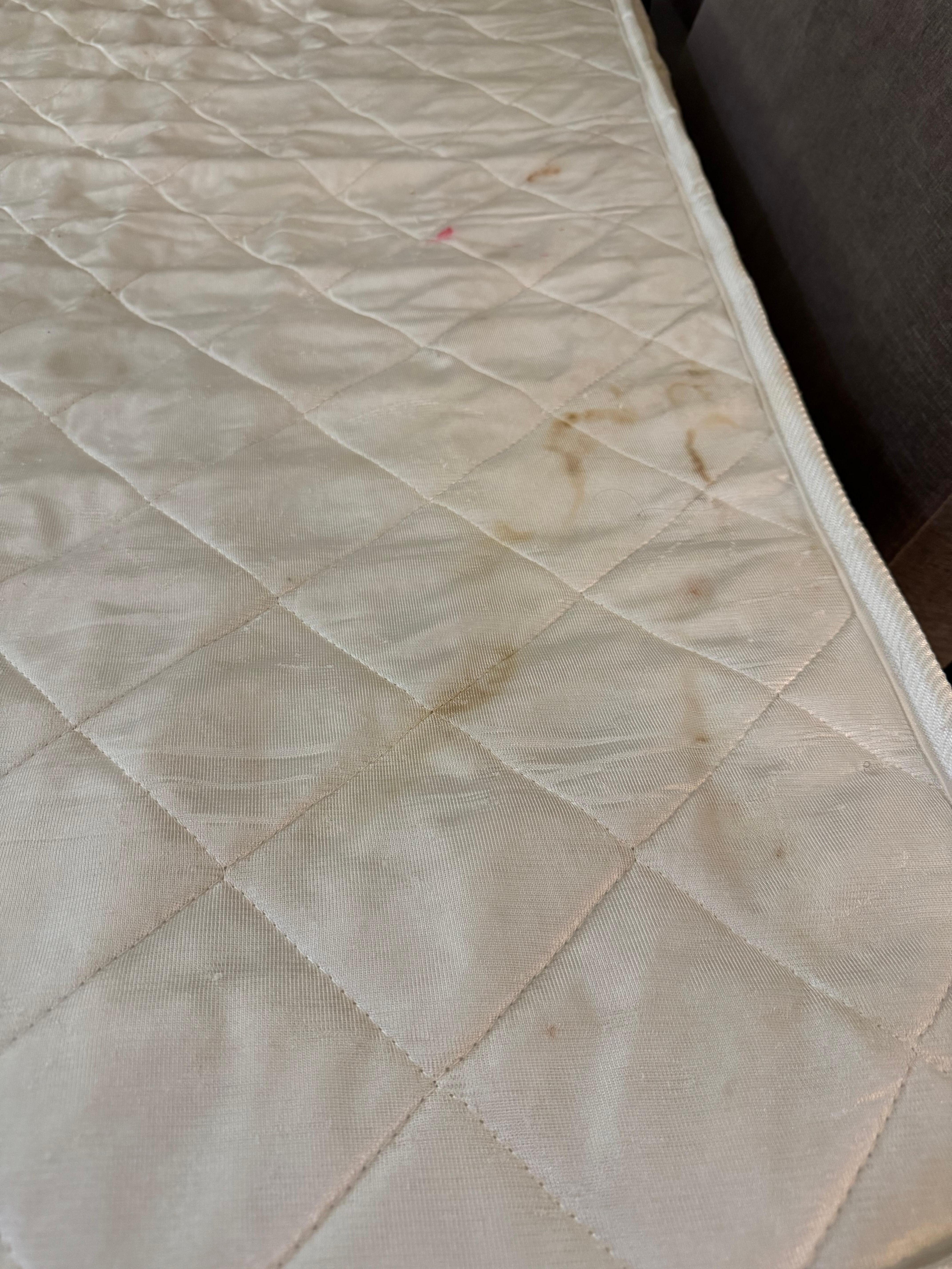 Dirty, marked ó stained with suspicious red marks on mattress 