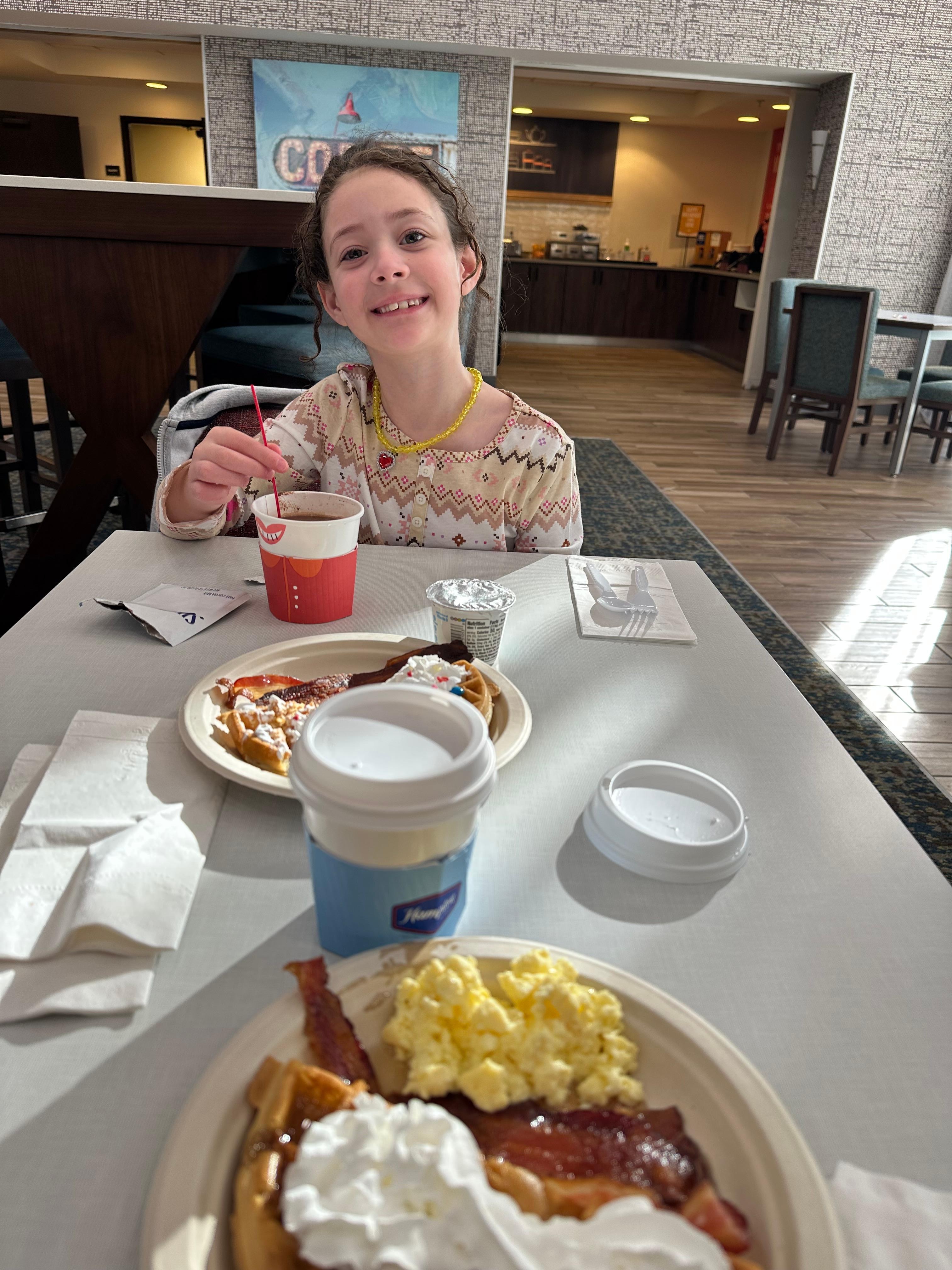 Tasty waffle with all sorts of candies, sprinkles, & whipped cream! Bacon & yogurt, too! 