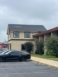 Roof of lobby missing shingles