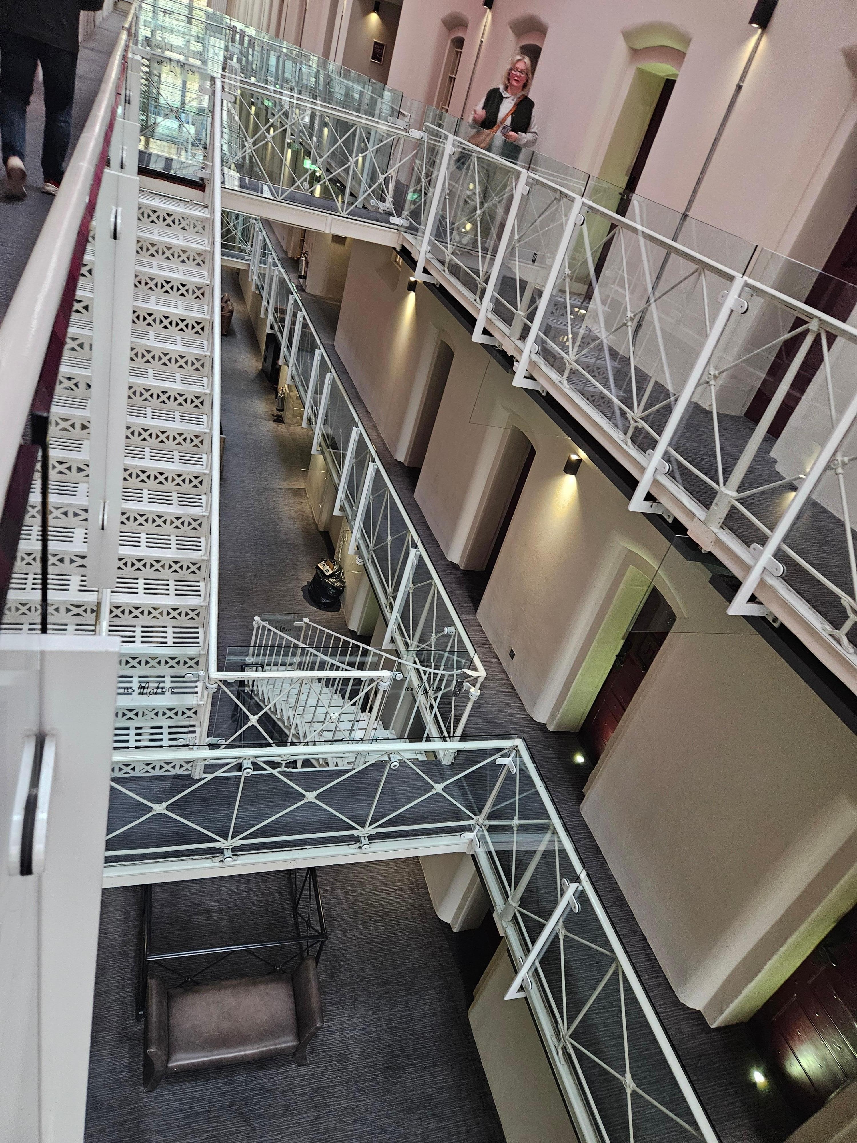 hallway of main rooms. looks like the old cell block. so cool