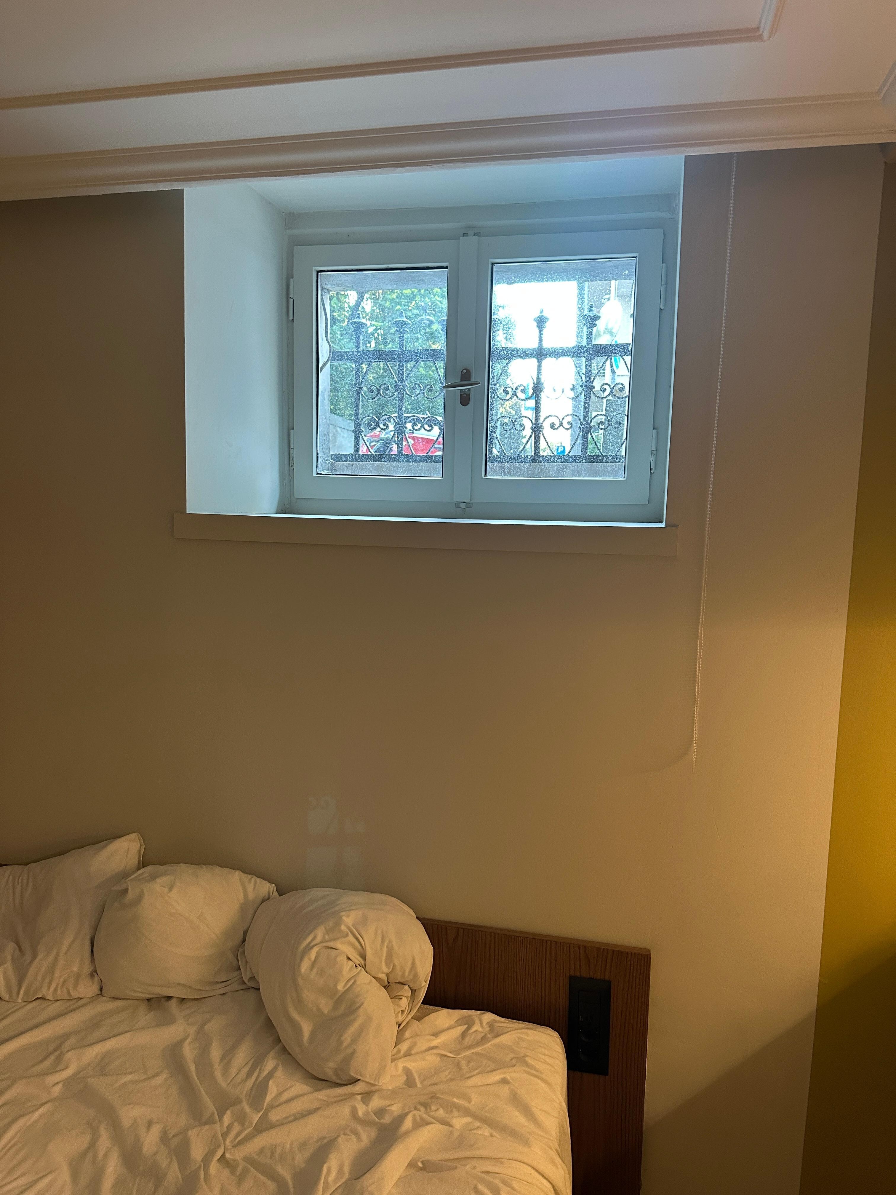 Basement window with bars — no emergency exit