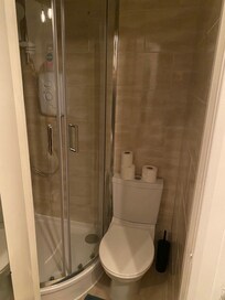 Bathroom with no sink to wash hands or brush teeth.