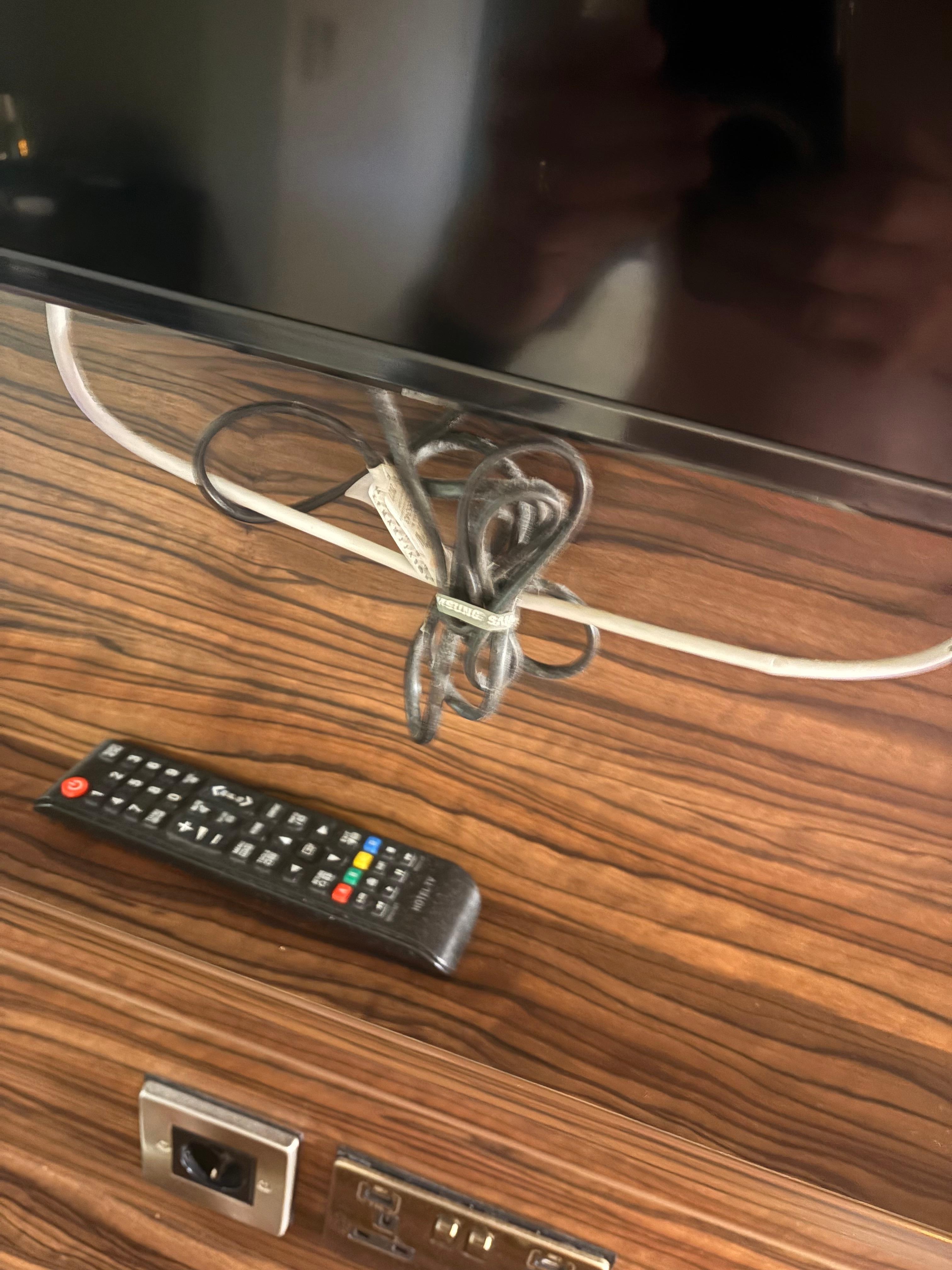 Cables hanging from the TV