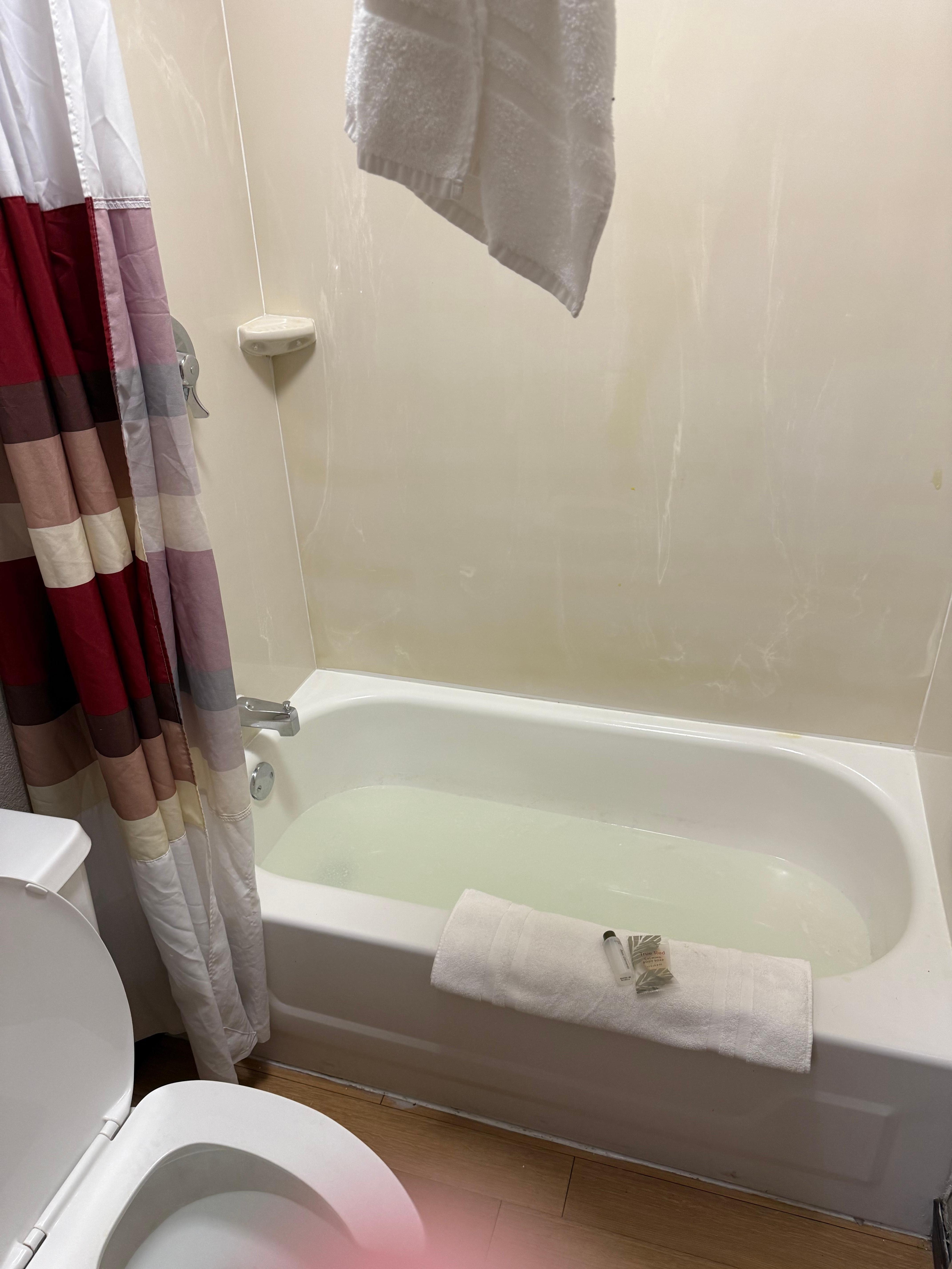 Tub full of water and bathroom not cleaned 