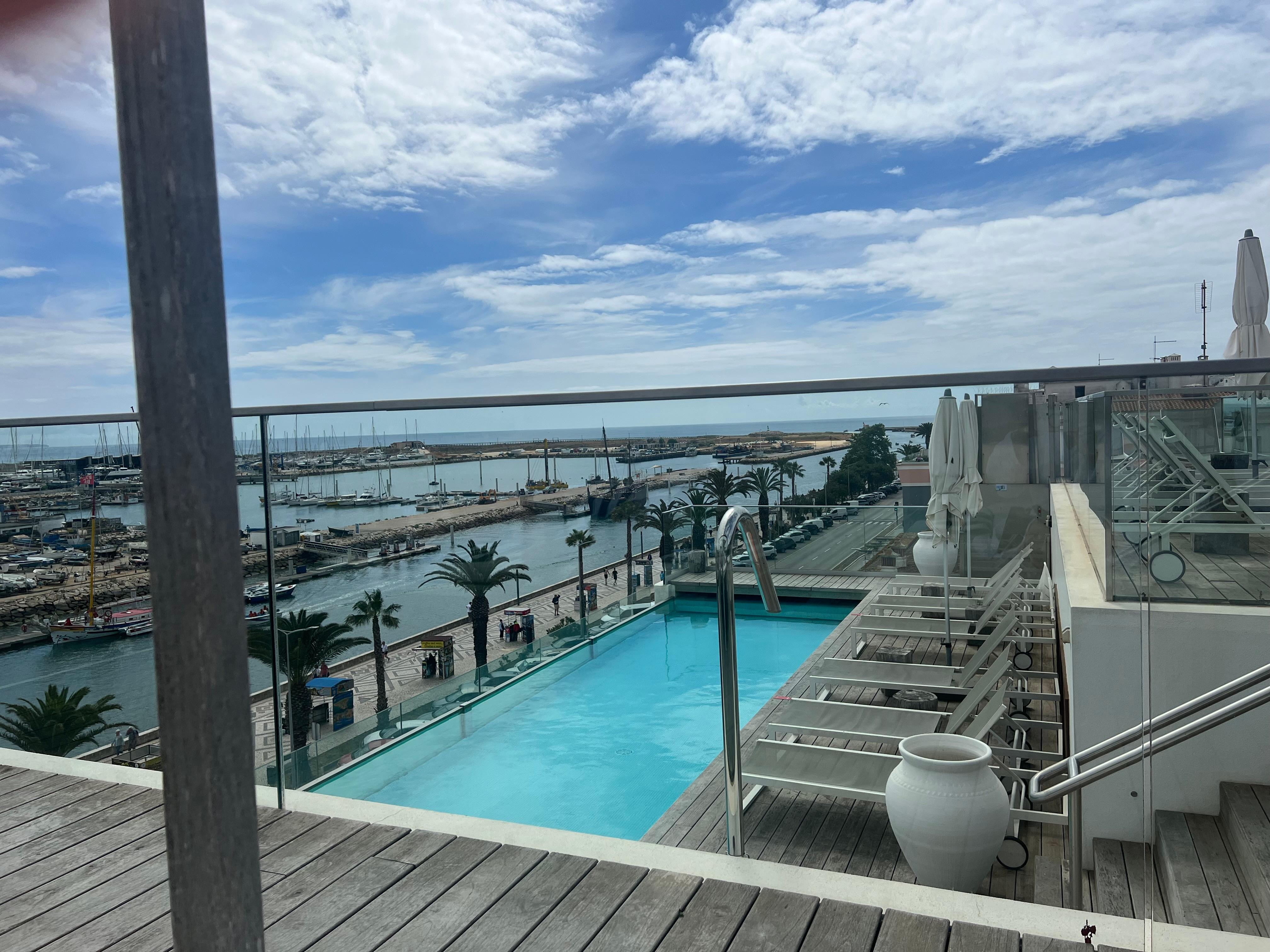 Rooftop pool with great views and a bar. Even 2 large beds with canopy.
