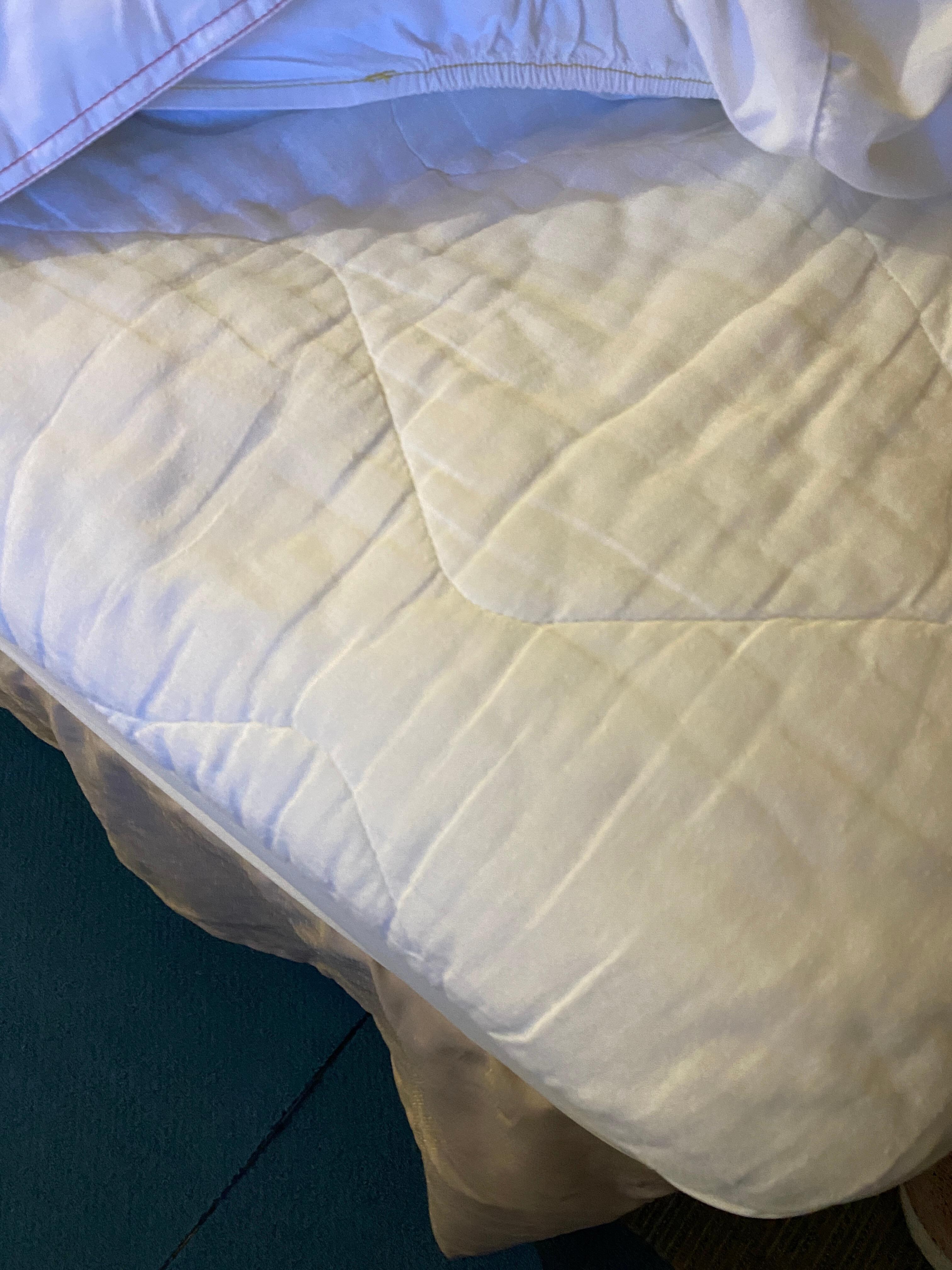Luckily, I had some bedding in my car and I just put that on top of the bed and slept on that.