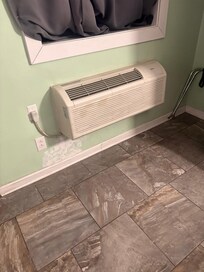 Air conditioner was nasty looks like they patched the wall and never repainted