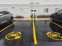 Two parking spaces dedicated to electric vehicles.