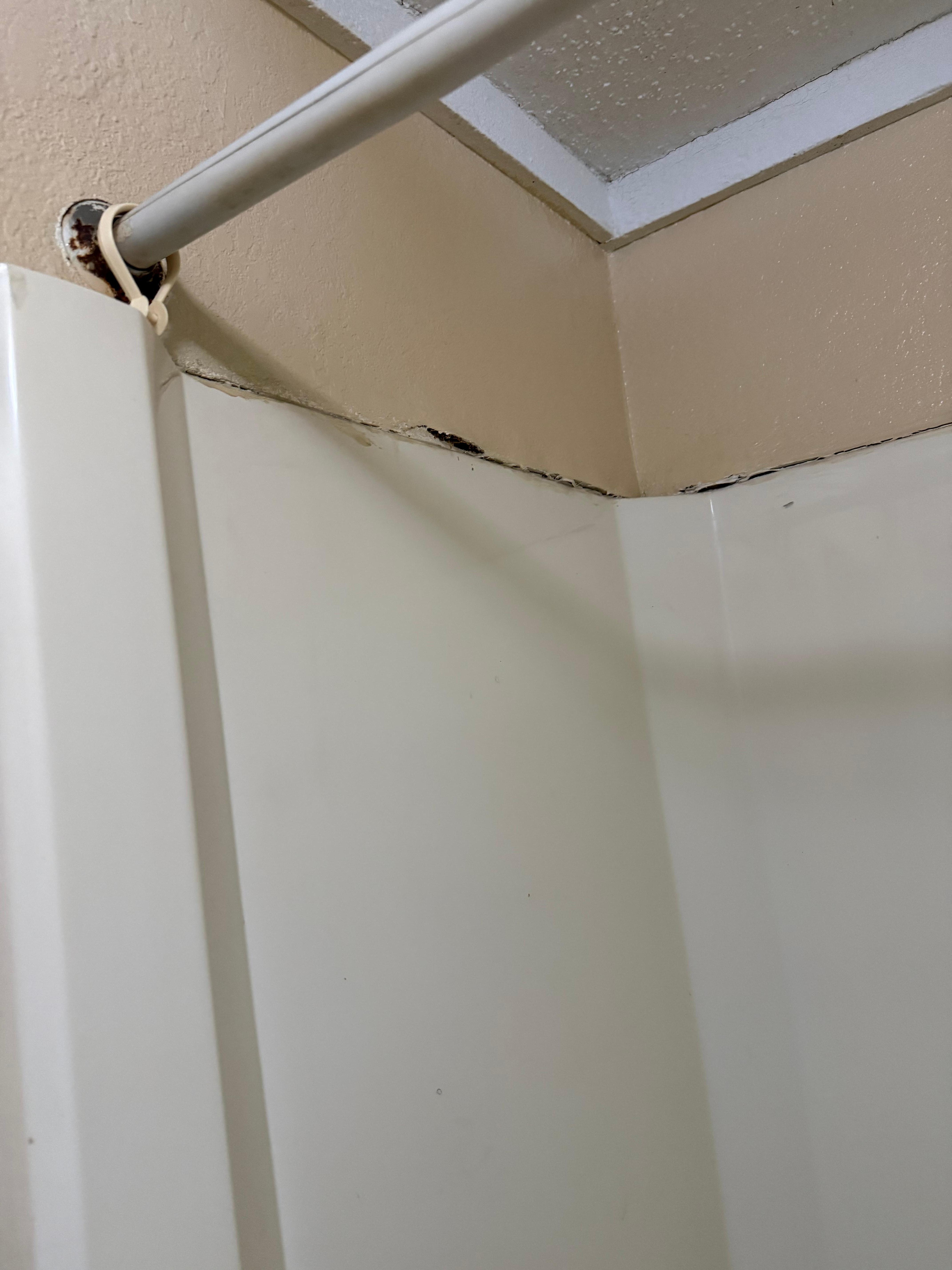 Hole above shower wall