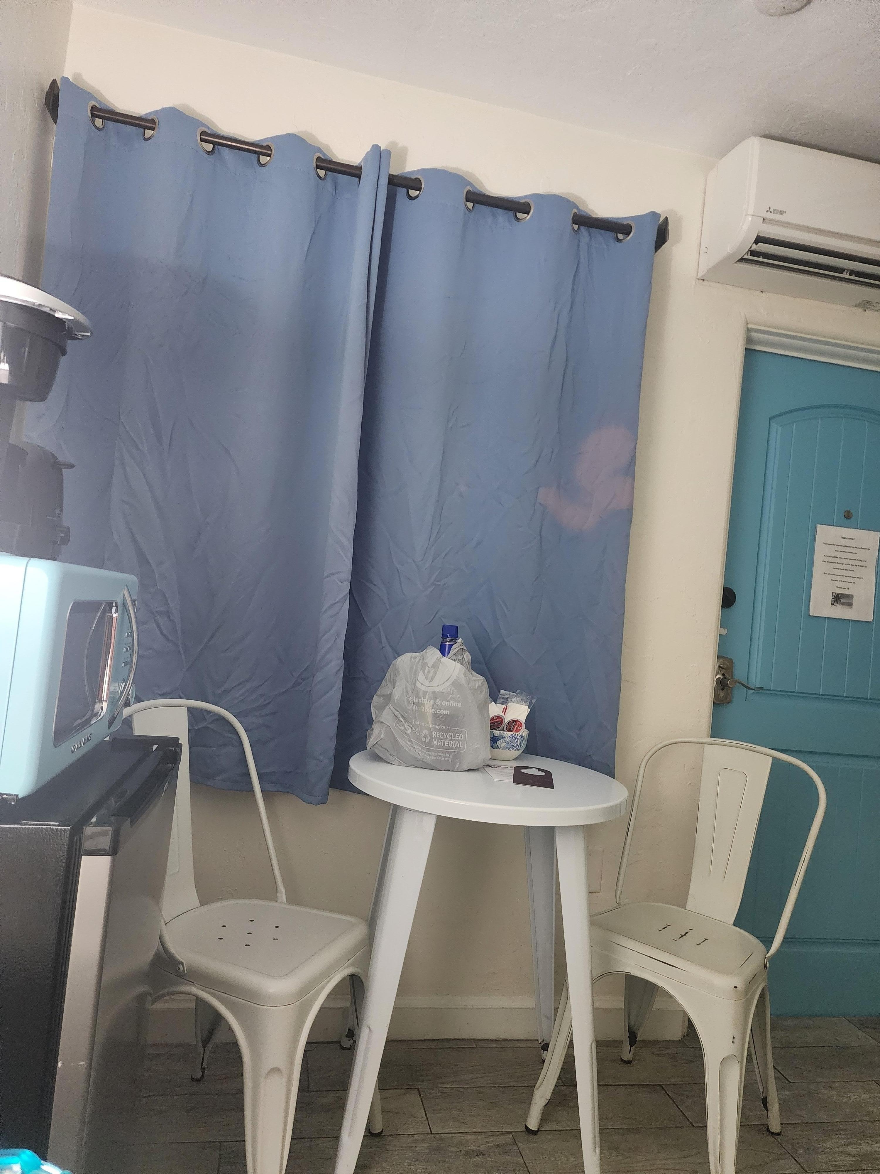 Old wrinkled, bleached curtains.