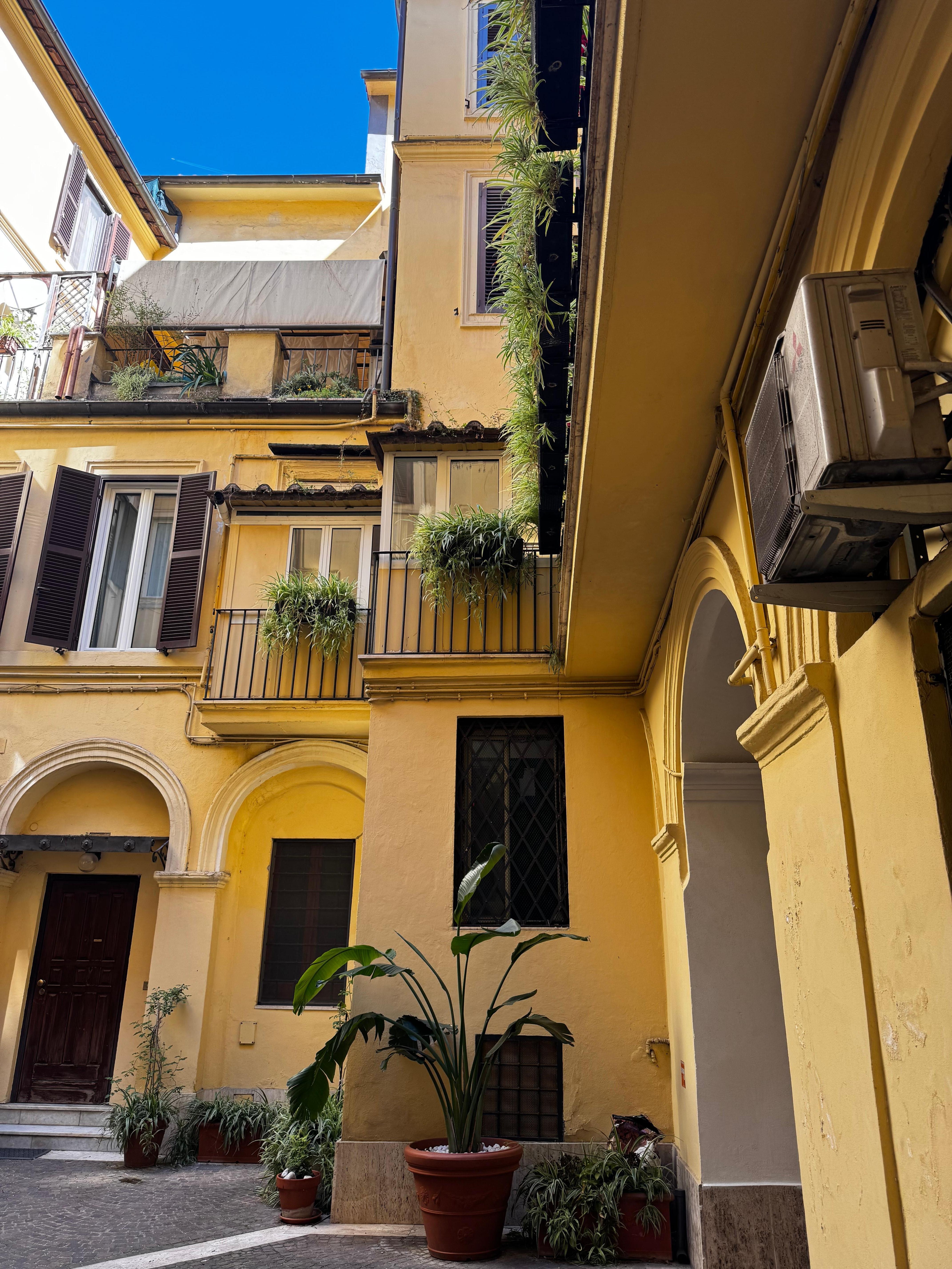Huge wooden doors open to interior courtyards. Proceed to this main courtyard for the hotel entrance. 