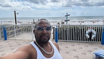 Outside at the pool with beach view behind me