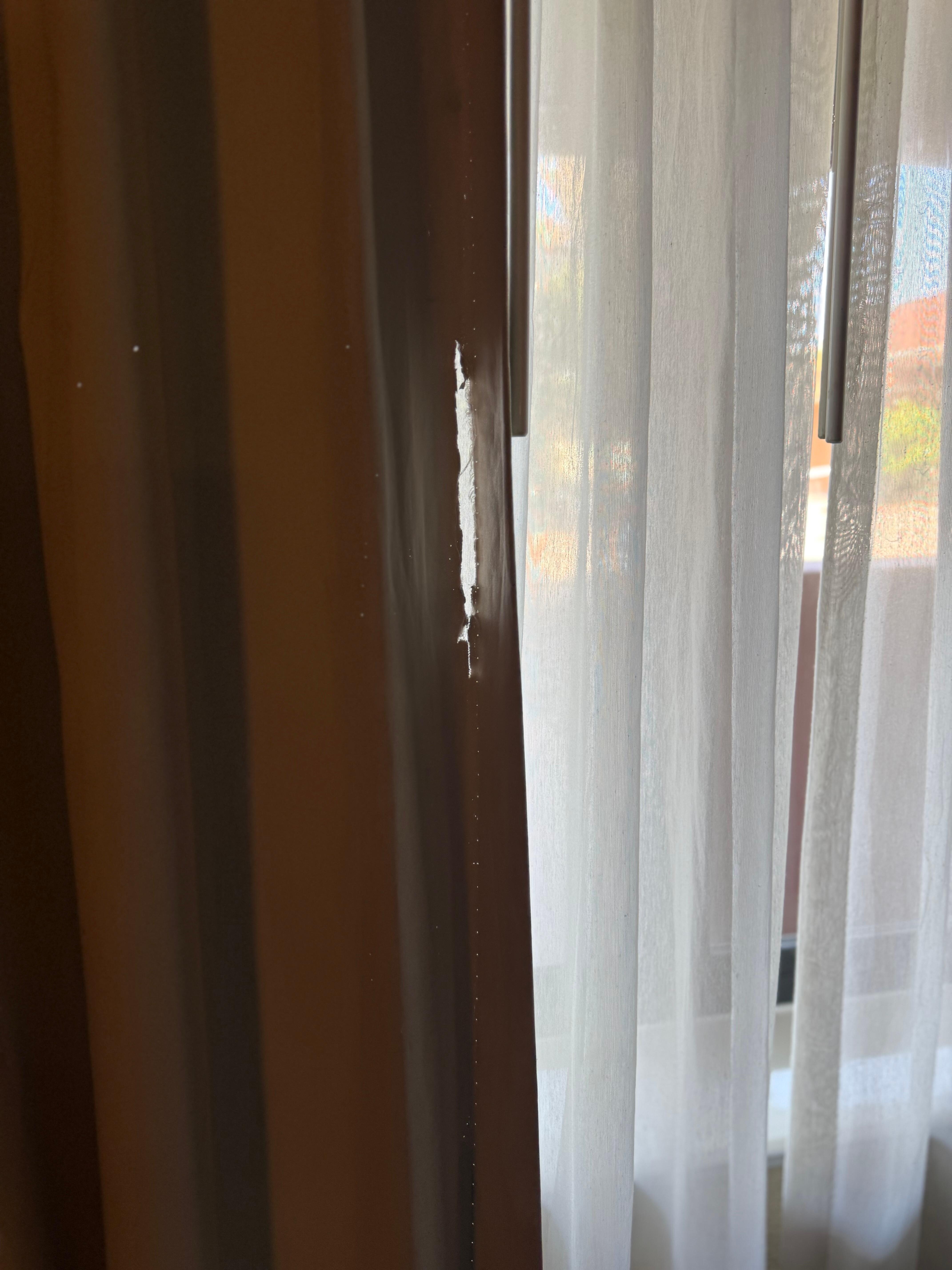 This is the torn blackout shade in our room - disgusting.