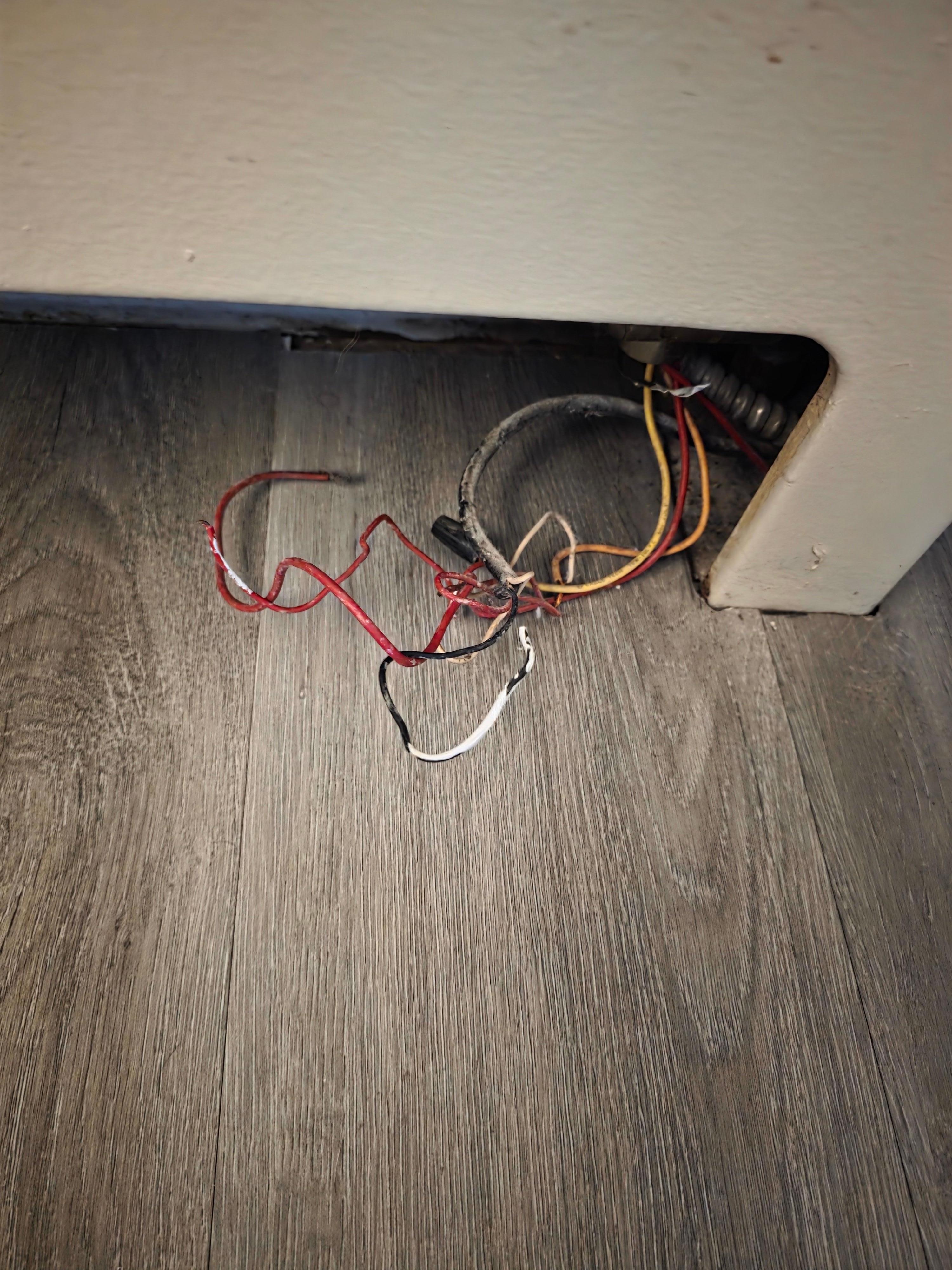 Bundle of wires under heat radiator